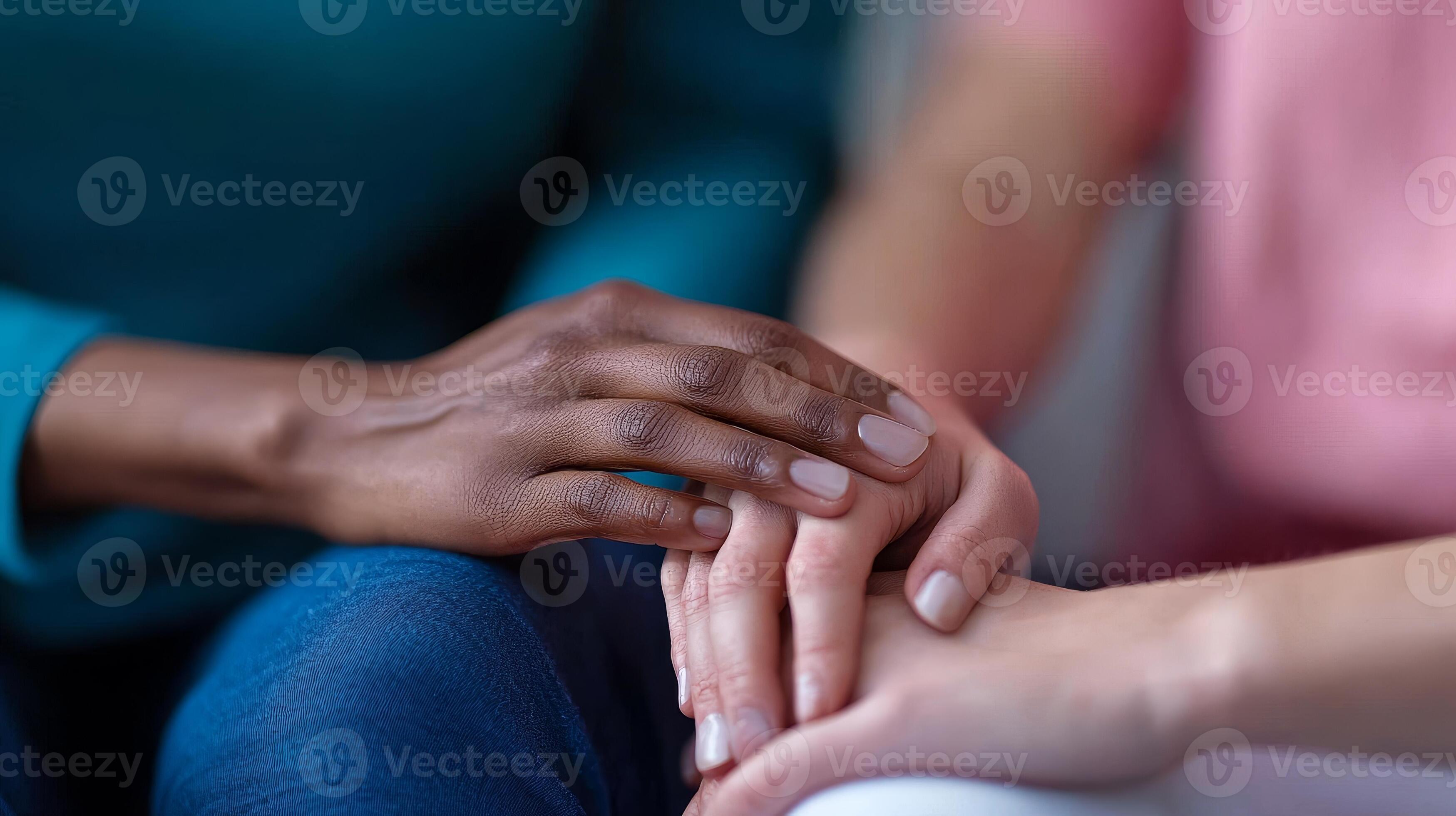 Two hands reaching out, showing compassion and support on a soft ...