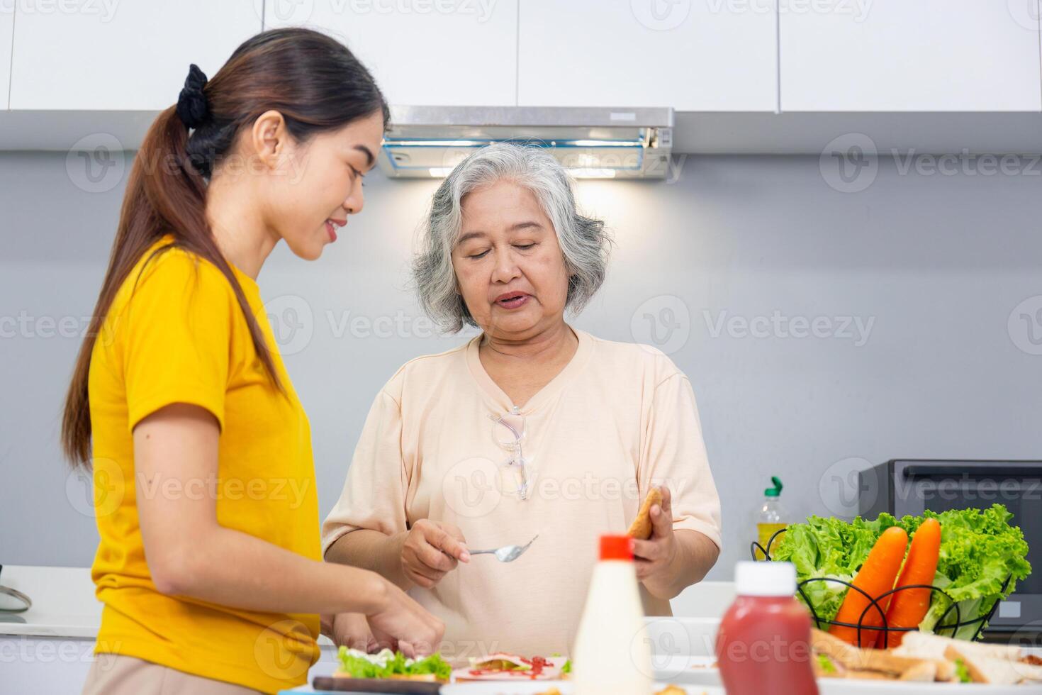 Senior asian mother and middle aged daughter cooking together at kitchen 51011681 Stock Photo at ...