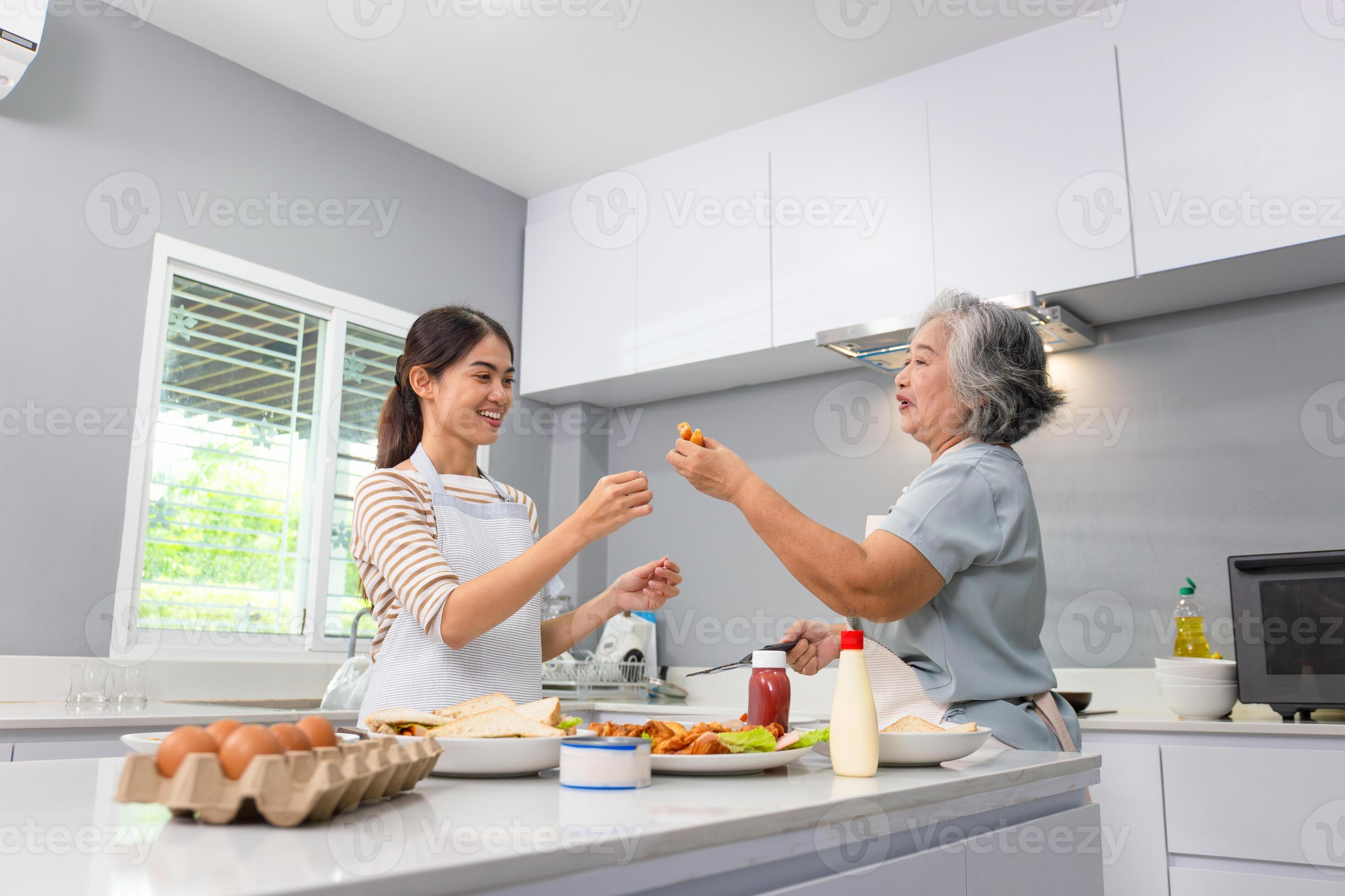 Cheerful senior Asian mother and middle aged daughter cooking together 51011752 Stock Photo at ...