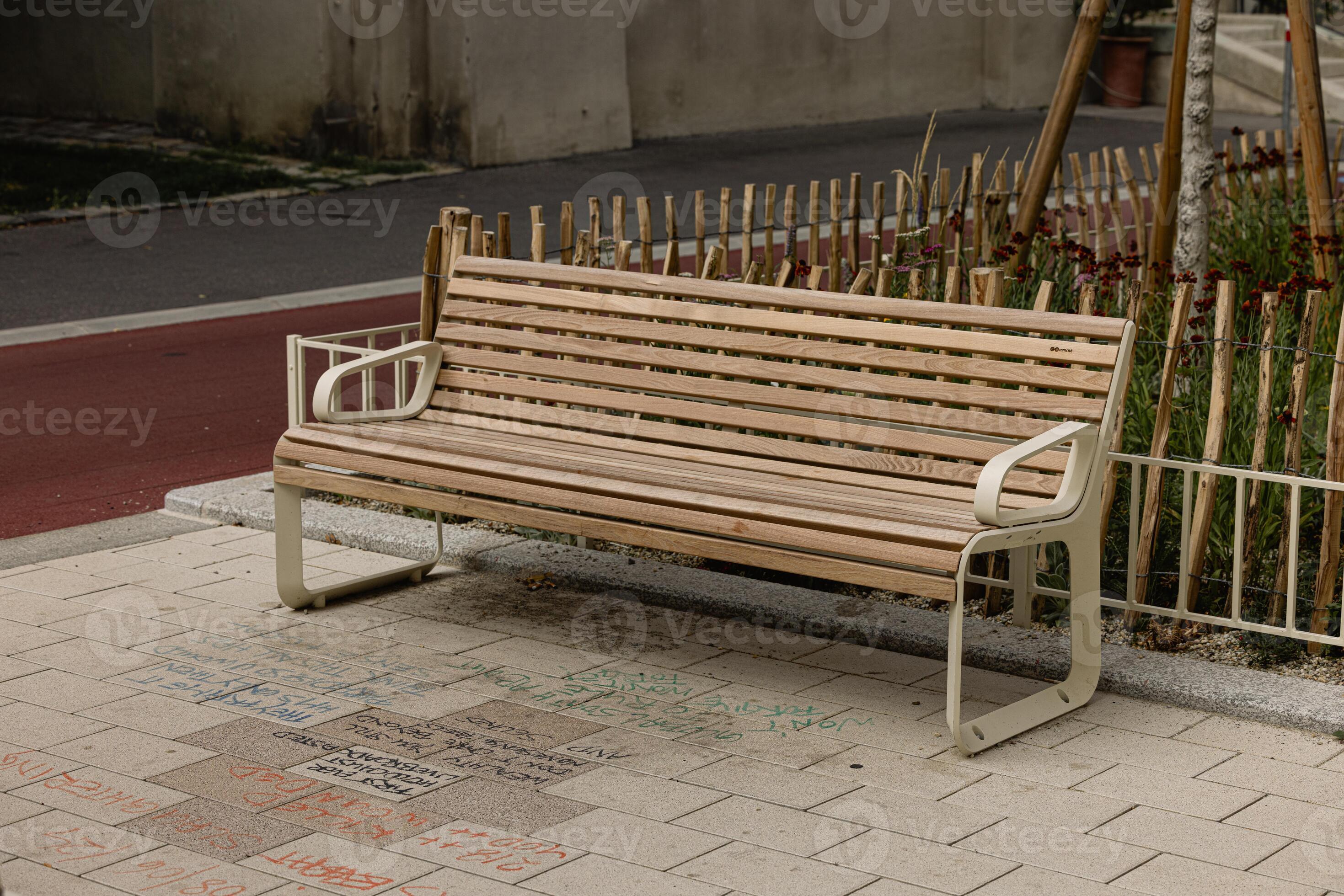 Modern benches in the city square on a sunny day. City improvement, urban planning, public ...