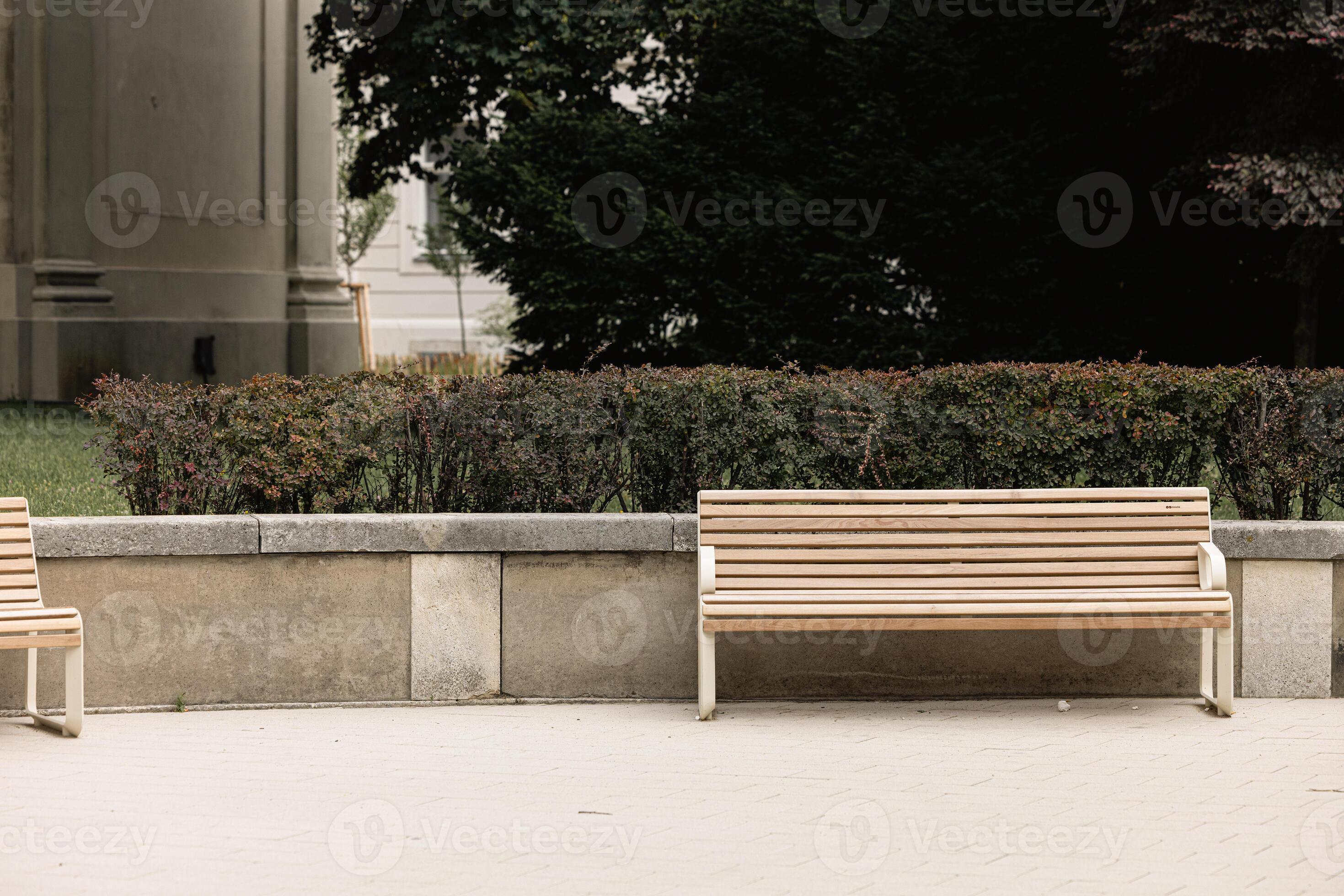 Modern benches in the city square on a sunny day. City improvement, urban planning, public ...