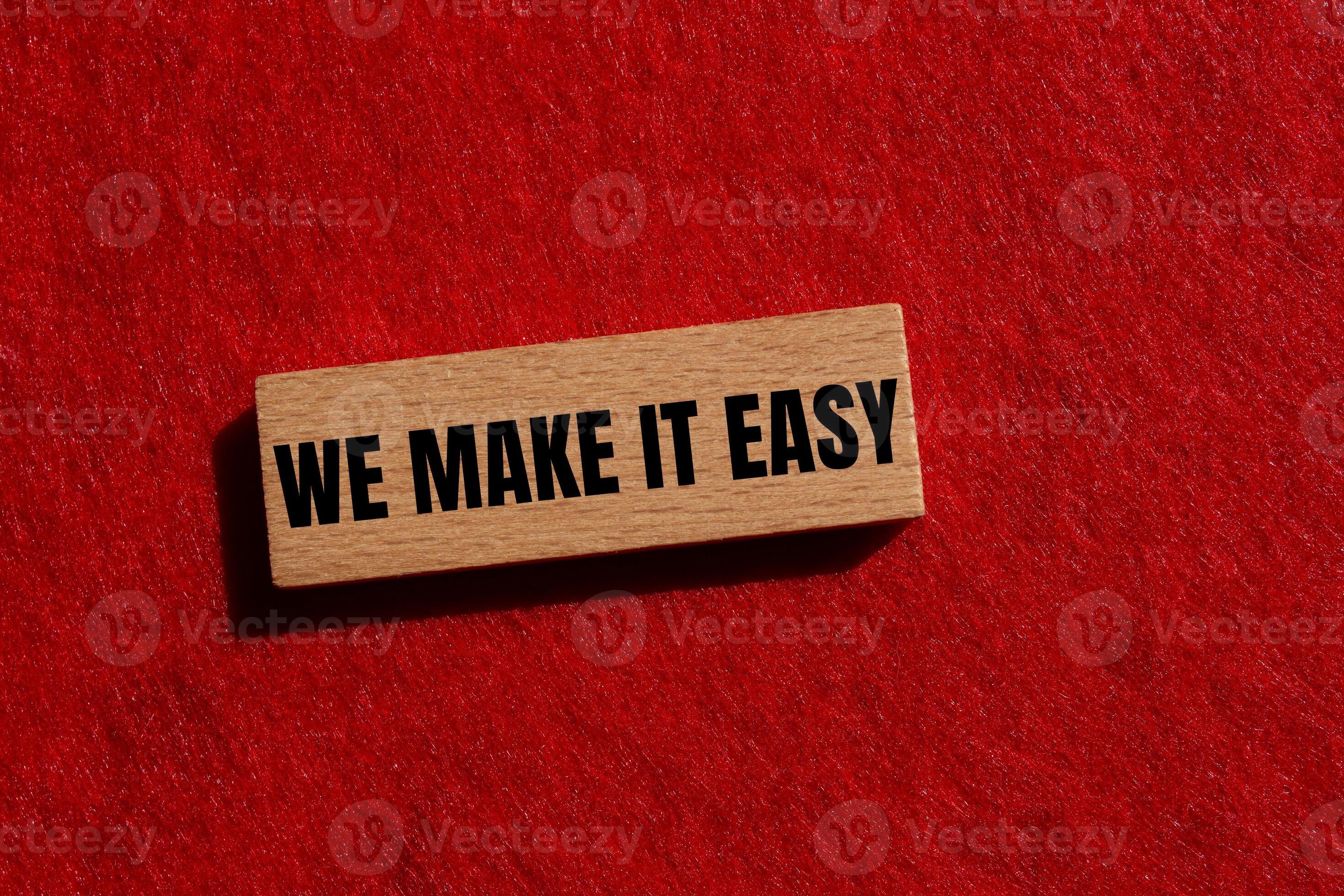 We make it easy message written on wooden block with red felt background. Conceptual we make it ...