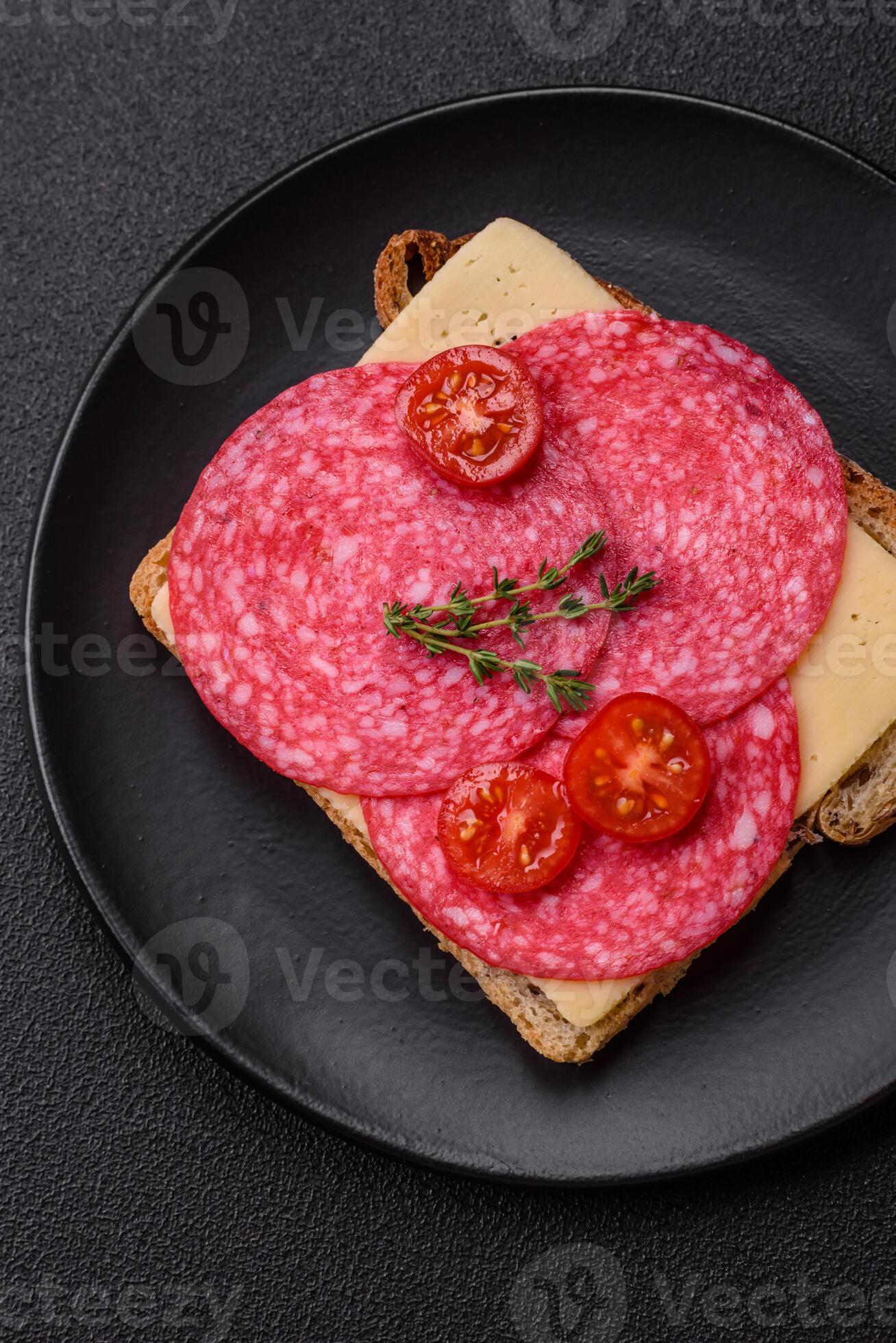 Sandwich with toast, salami slices, cheese and tomatoes, salt and spices 51175652 Stock Photo at ...