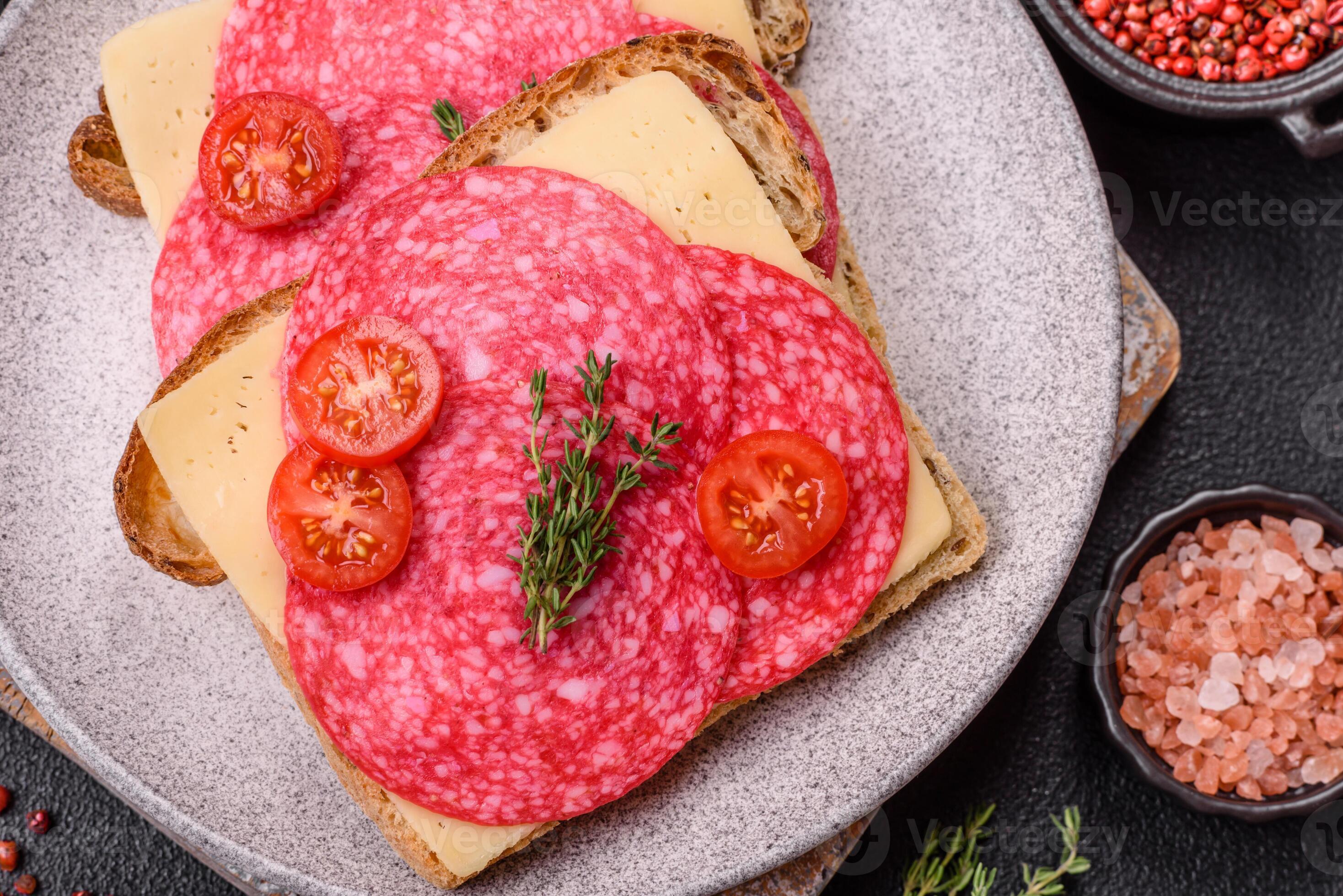 Sandwich with toast, salami slices, cheese and tomatoes, salt and spices 51175711 Stock Photo at ...