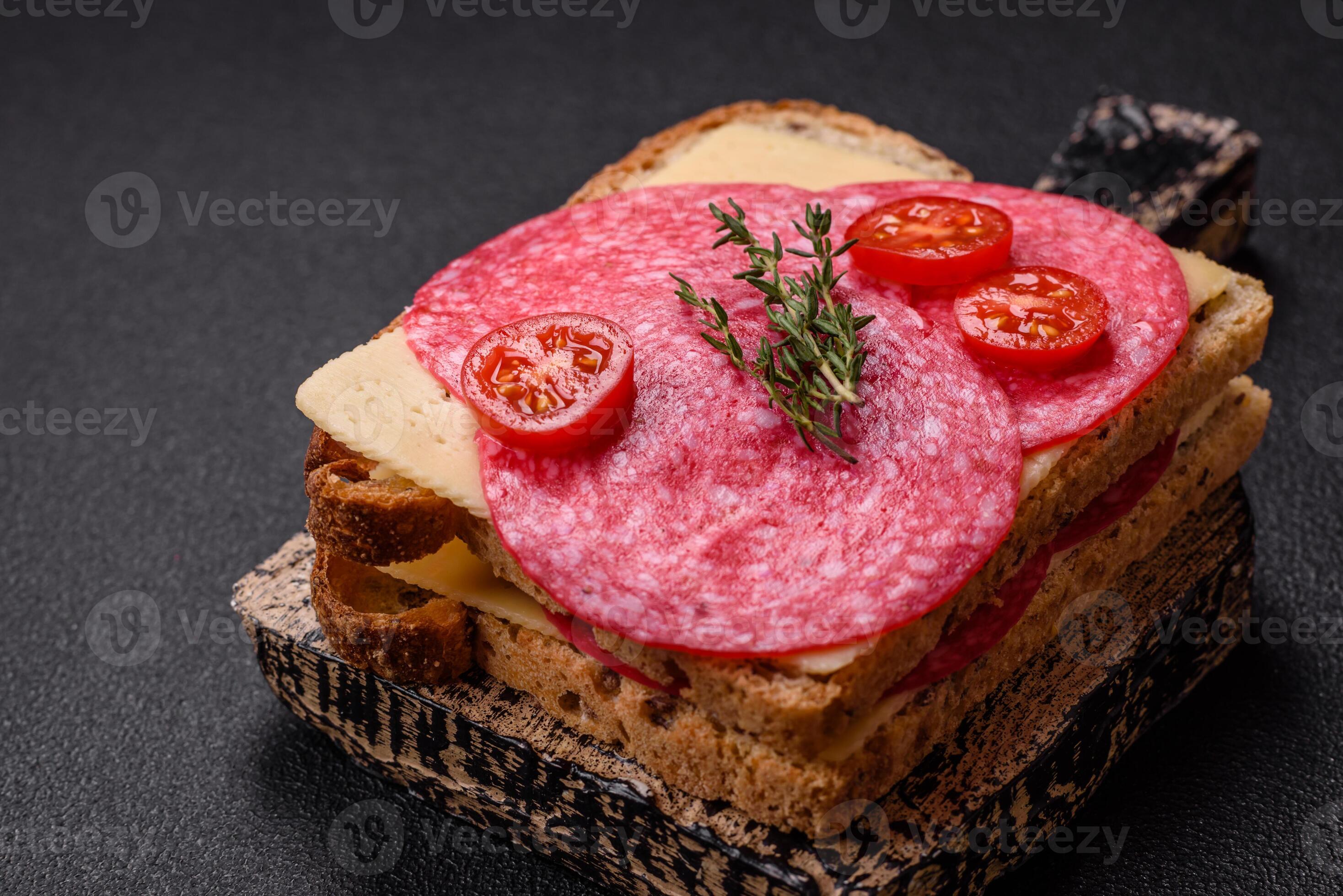 Sandwich with toast, salami slices, cheese and tomatoes, salt and spices 51175717 Stock Photo at ...