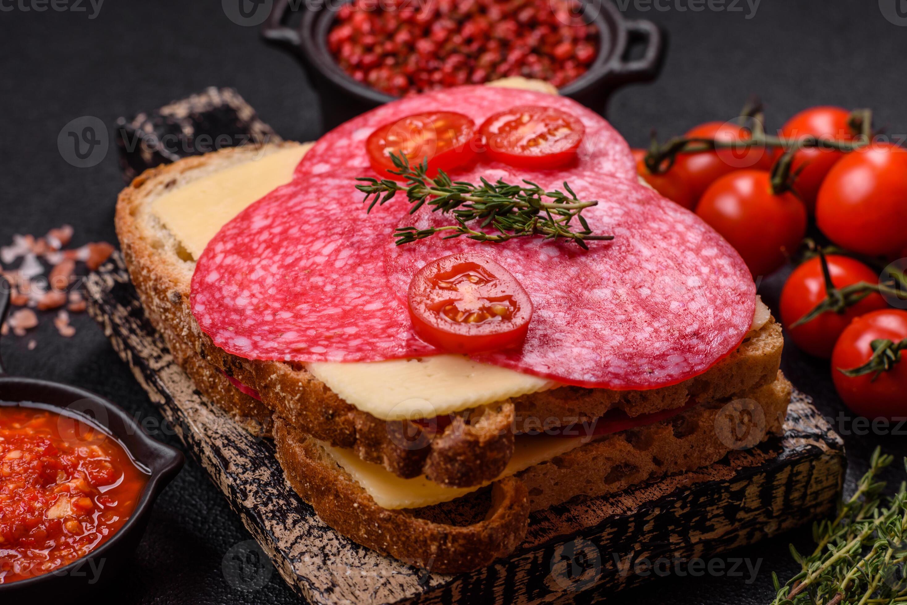 Sandwich with toast, salami slices, cheese and tomatoes, salt and spices 51175734 Stock Photo at ...