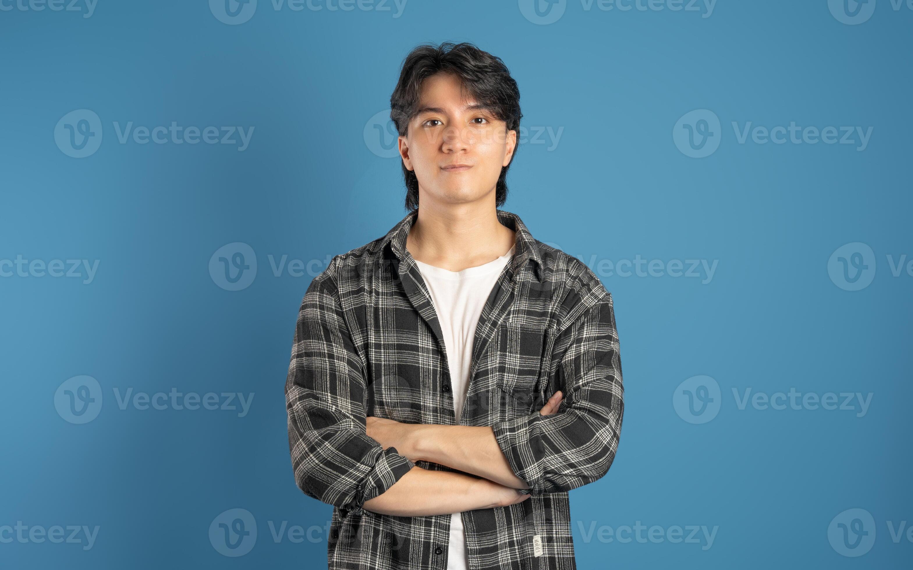 Portrait of Asian male student posing on blue background 51216605 Stock ...