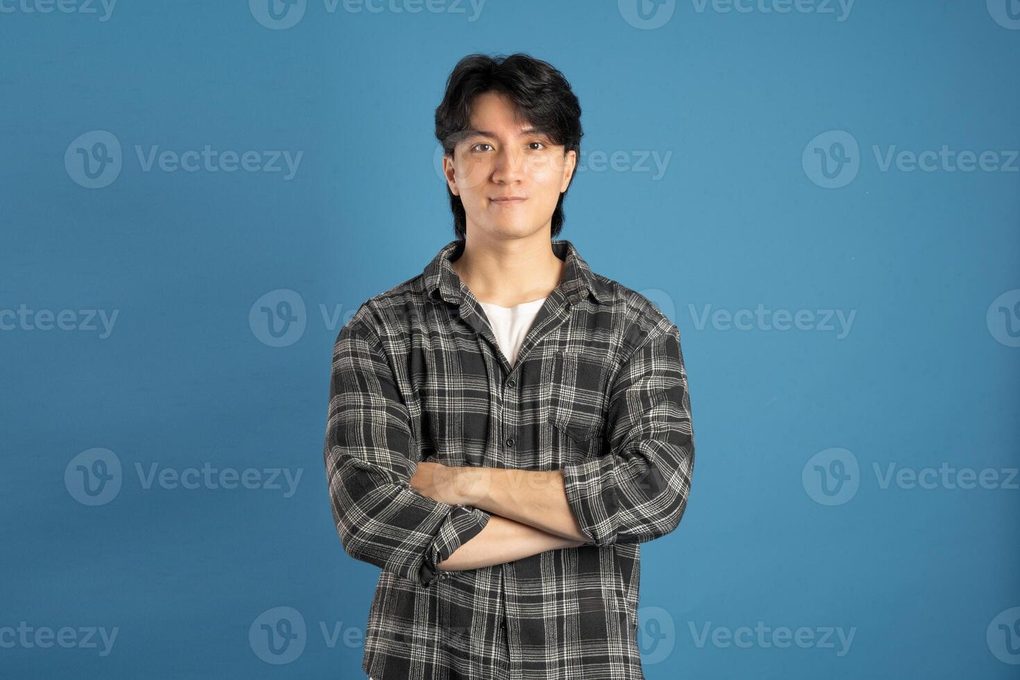 Portrait of Asian male student posing on blue background 51216755 Stock ...