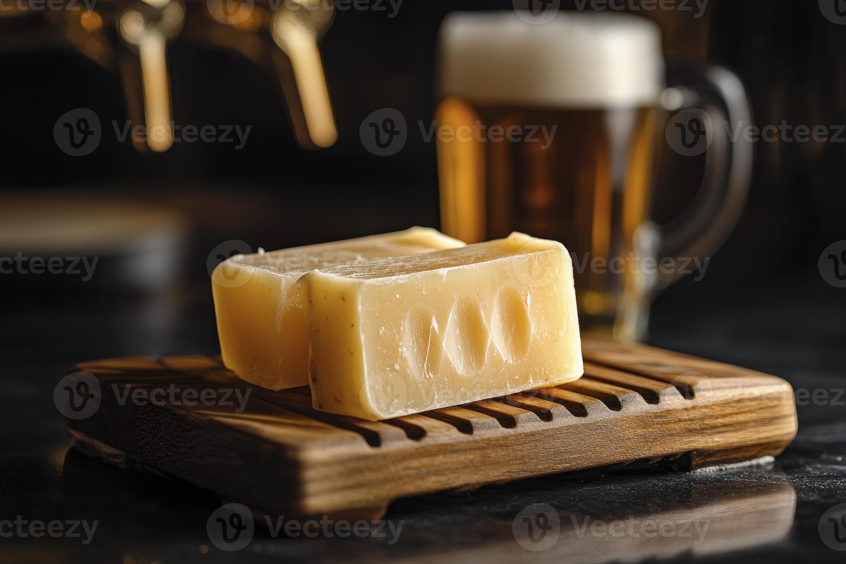 A soap bar on a wooden tray next to a beer 51265178 Stock Photo at Vecteezy