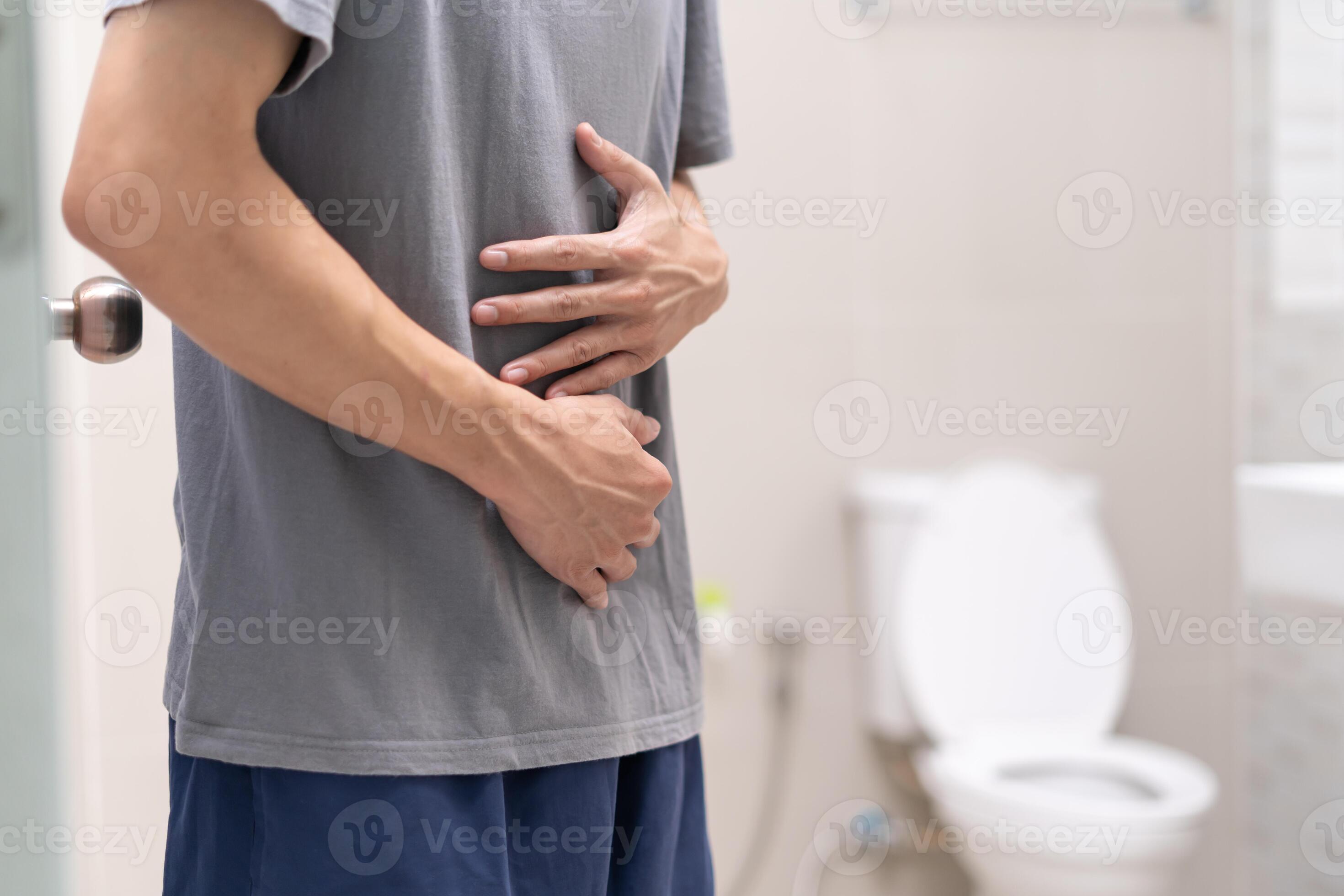Constipation and diarrhea in bathroom. Hurt man touch belly stomach ache painful. colon ...