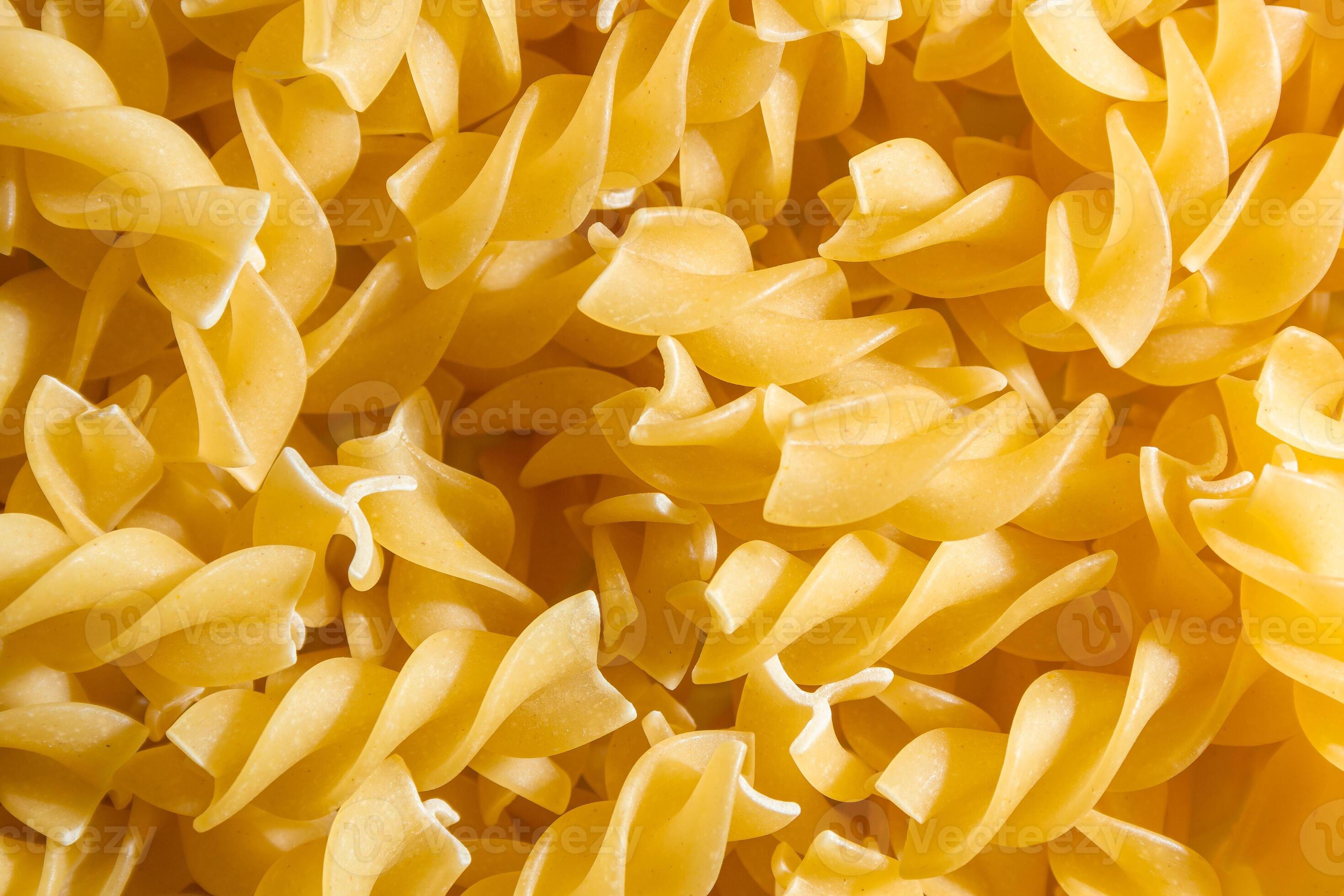 Uncooked Fusilli Pasta. A Culinary Canvas of Spiral Macaroni, Creating a Lively and Textured ...