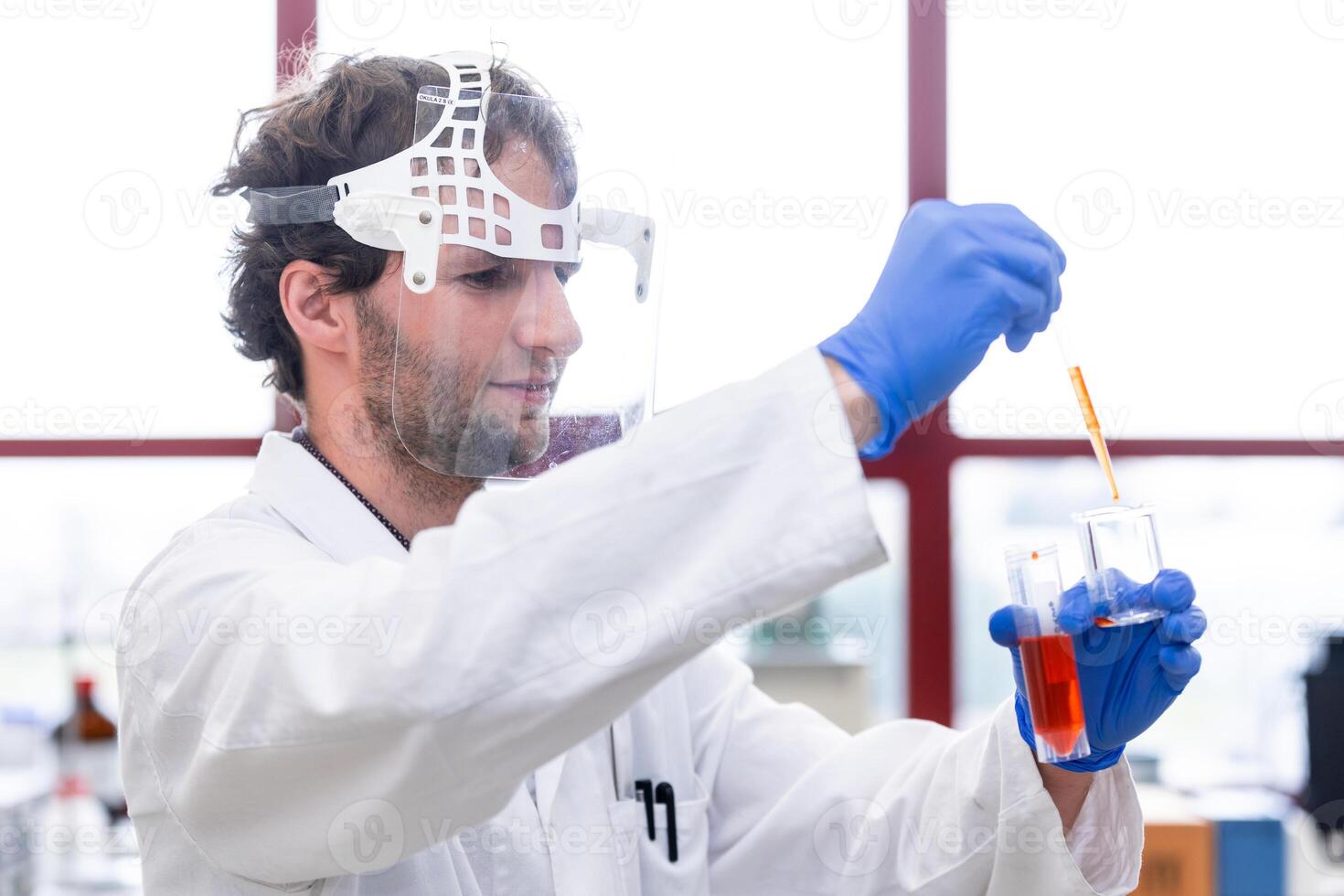 Young scientist in a research laboratory creating a scientific experiment, laboratory concept ...
