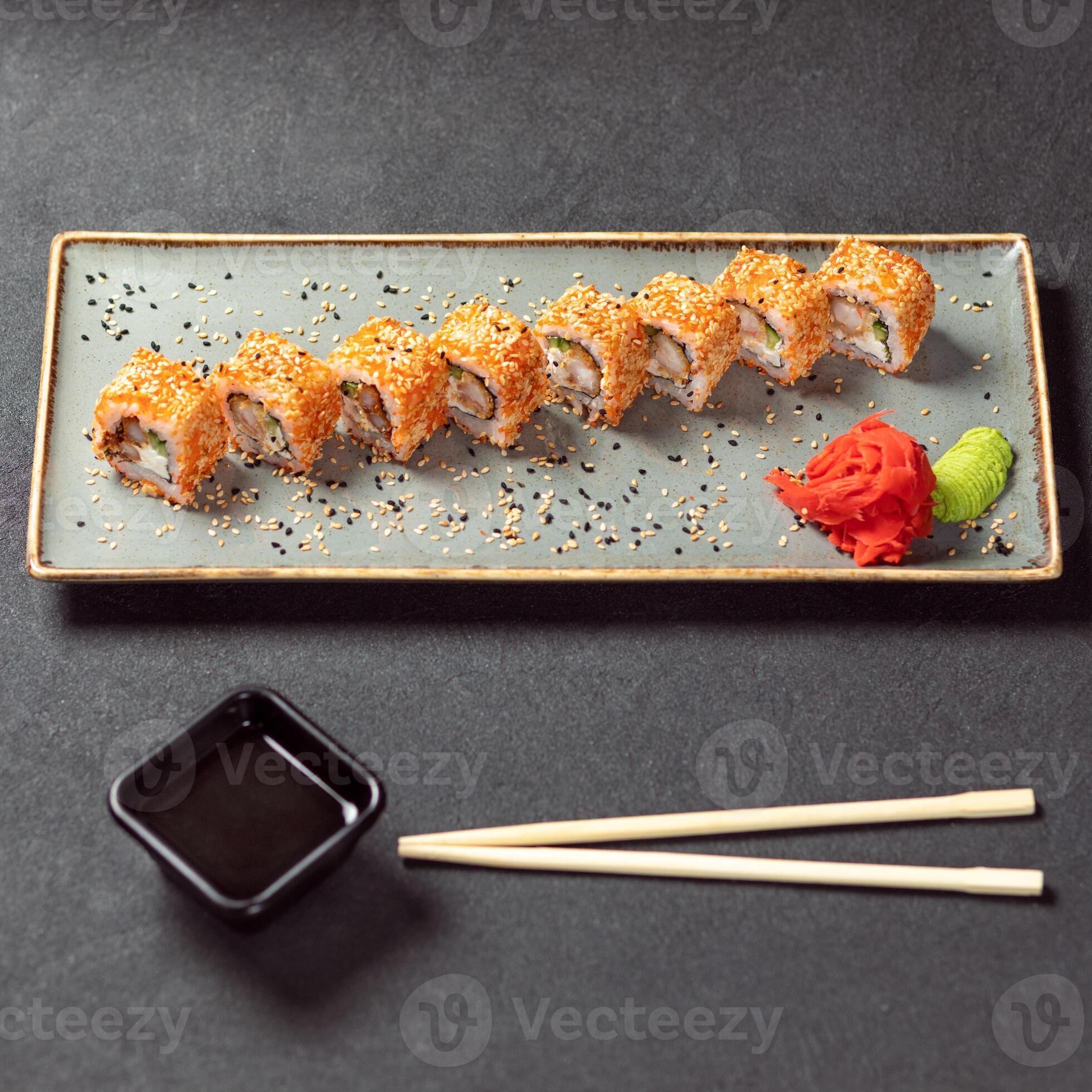 Kani Hot Sushi Roll with soya, wasabi, ginger and black chopstick 51464811 Stock Photo at Vecteezy
