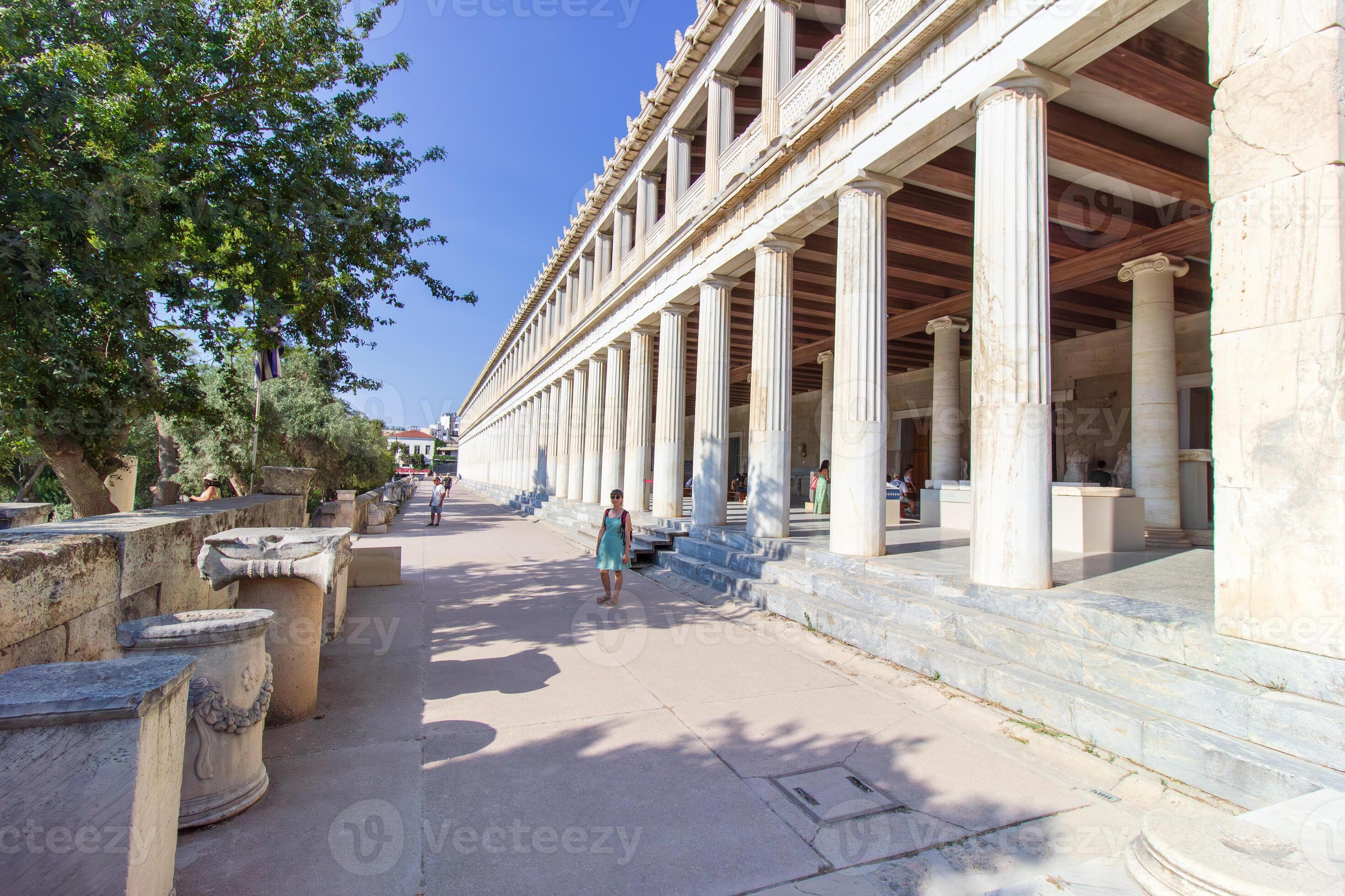A beautiful woman standing at columns of Housing the Museum of the Ancient Agora. Stoa of ...