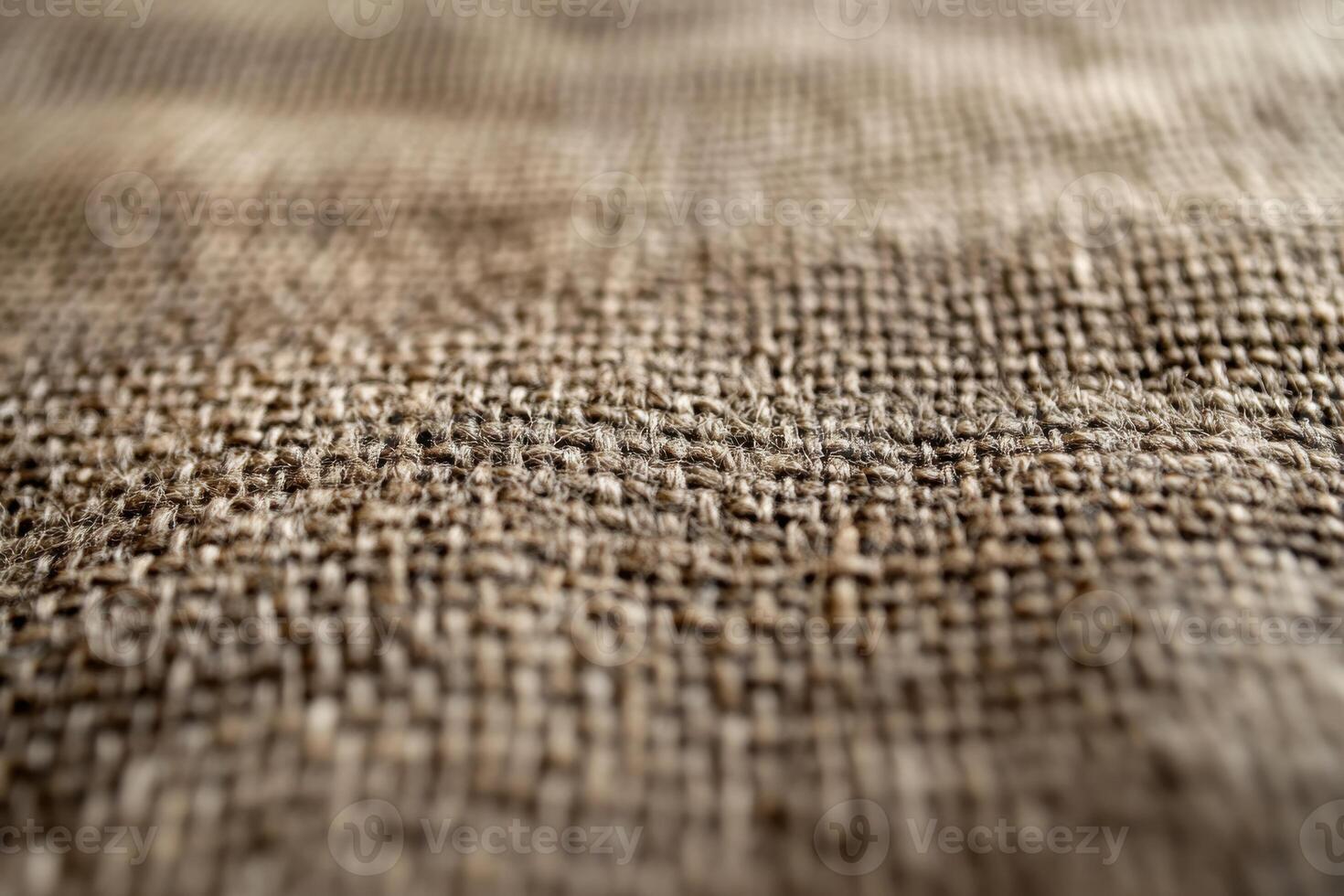 Close-up view of textured burlap fabric showing intricate weave patterns in natural light ...