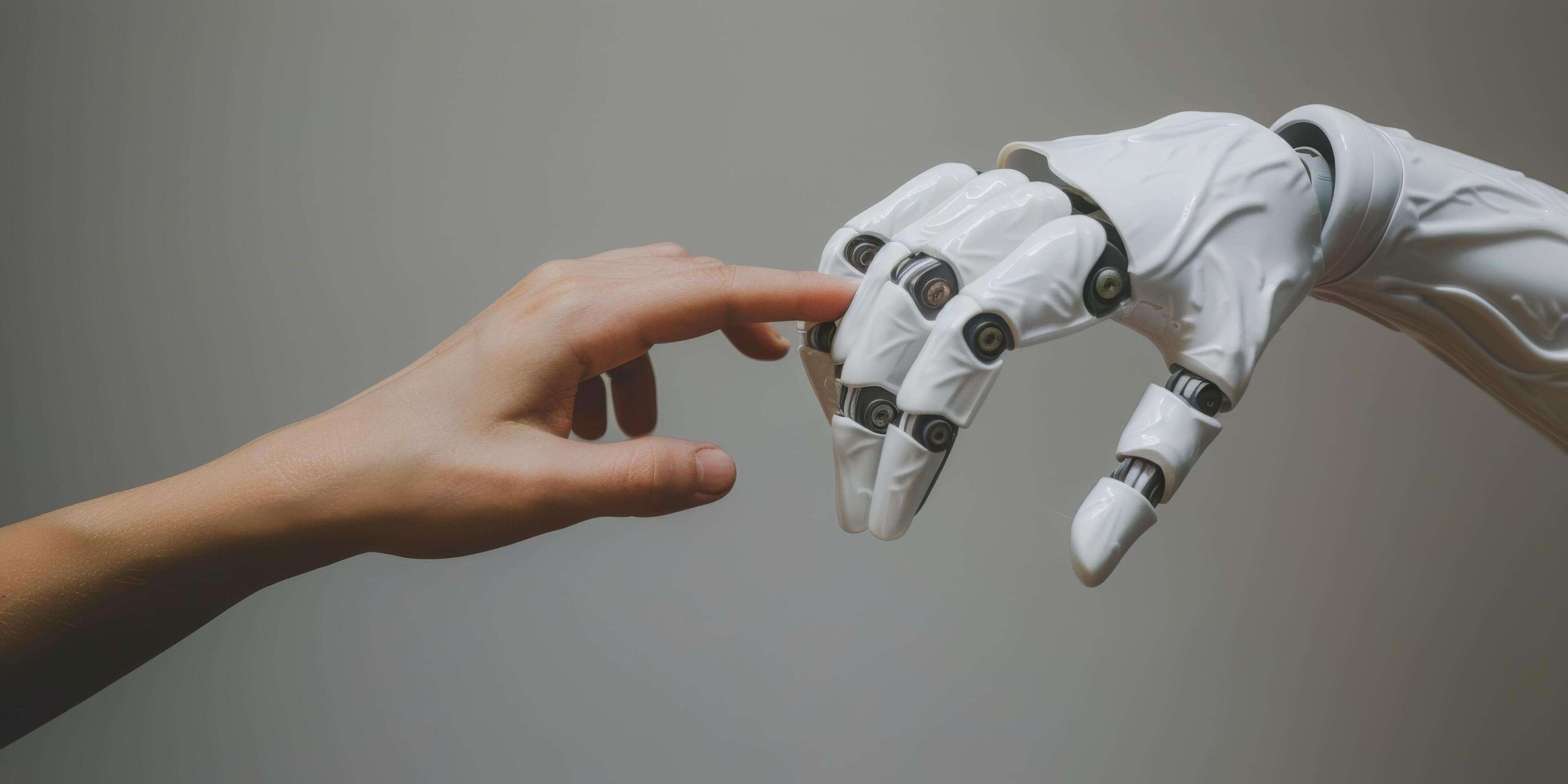 Human hand reaching toward a robotic hand in a symbolic gesture of connection and innovation ...