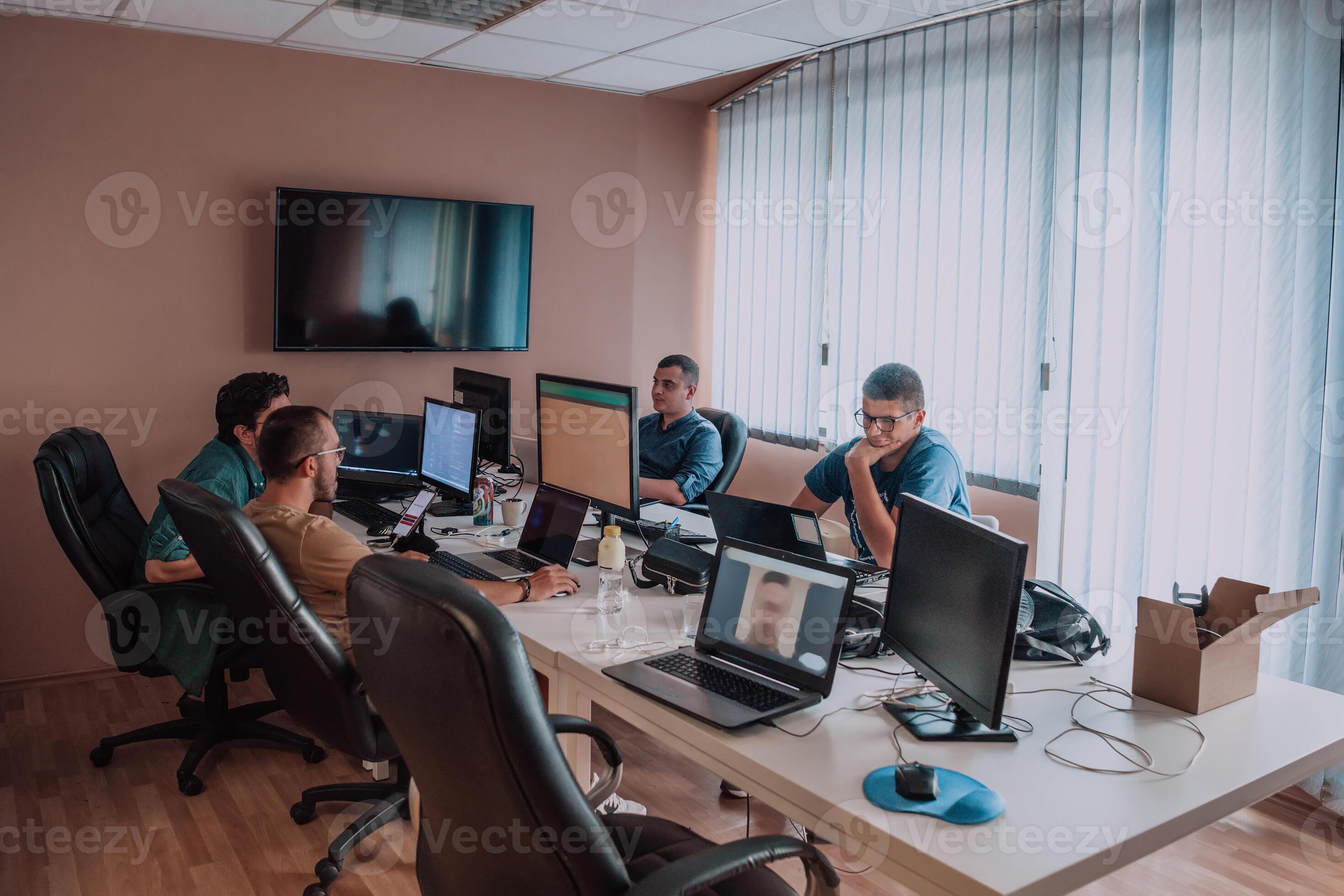 Programmers engrossed in deep collaboration, diligently working ...