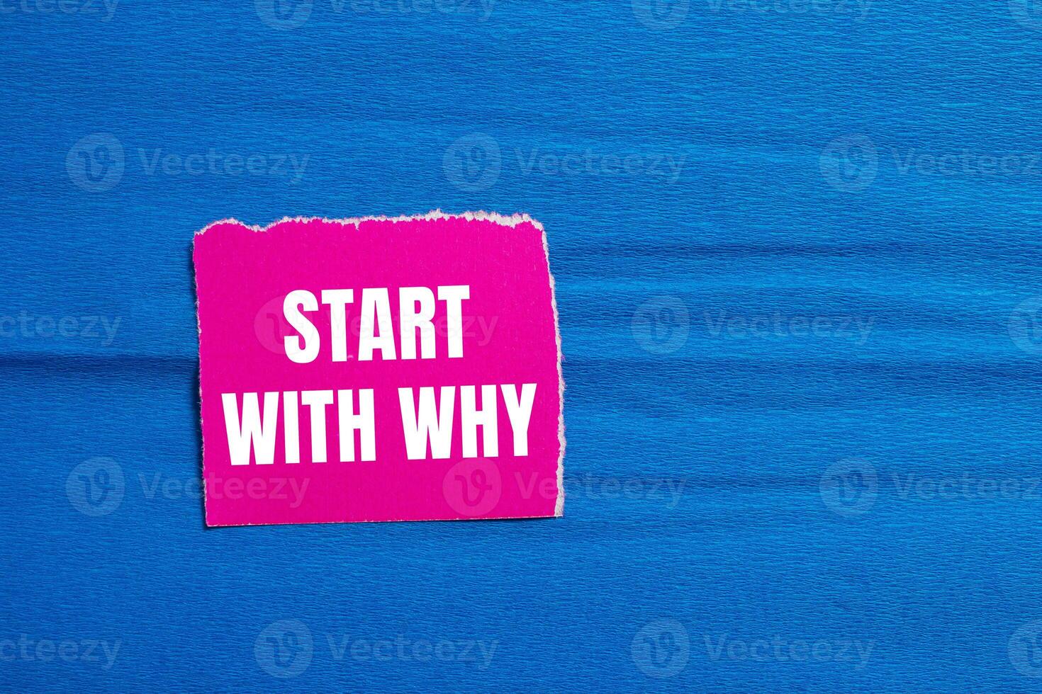 Start with why message written on ripped pink torn paper piece with blue background. Conceptual ...