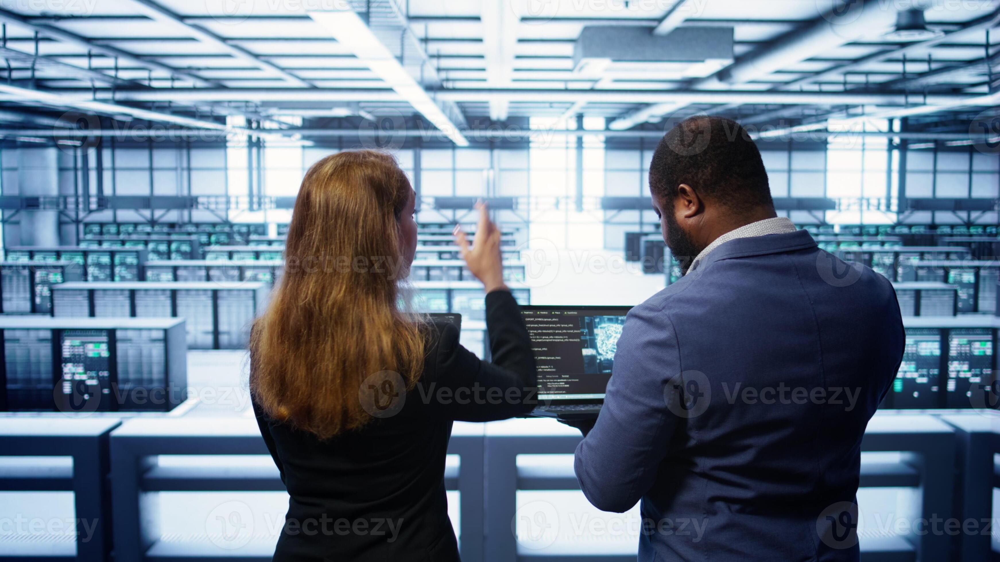 Teamworking Programmers In Data Center Overseeing Server Operations
