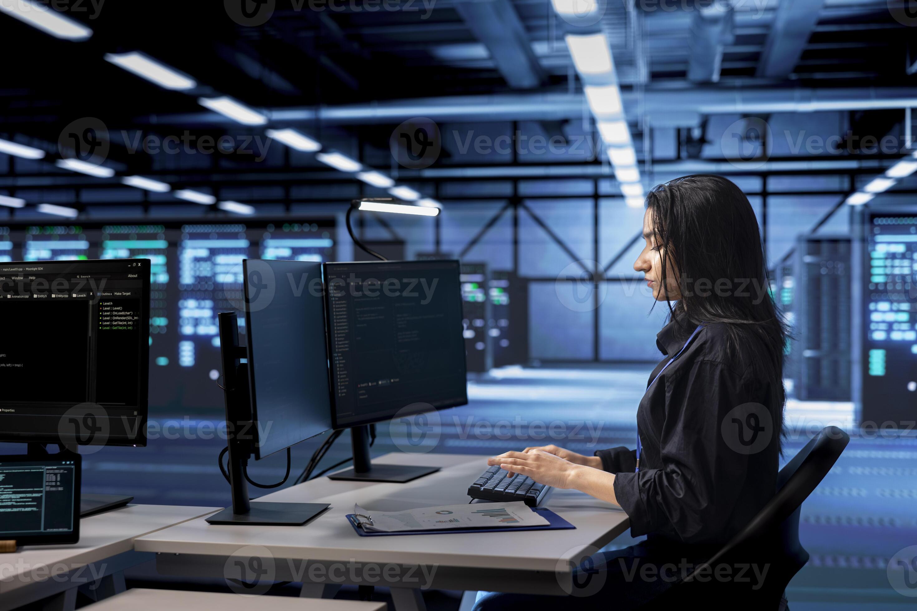 Programmer coding on PC, doing maintenance in data center to extend ...