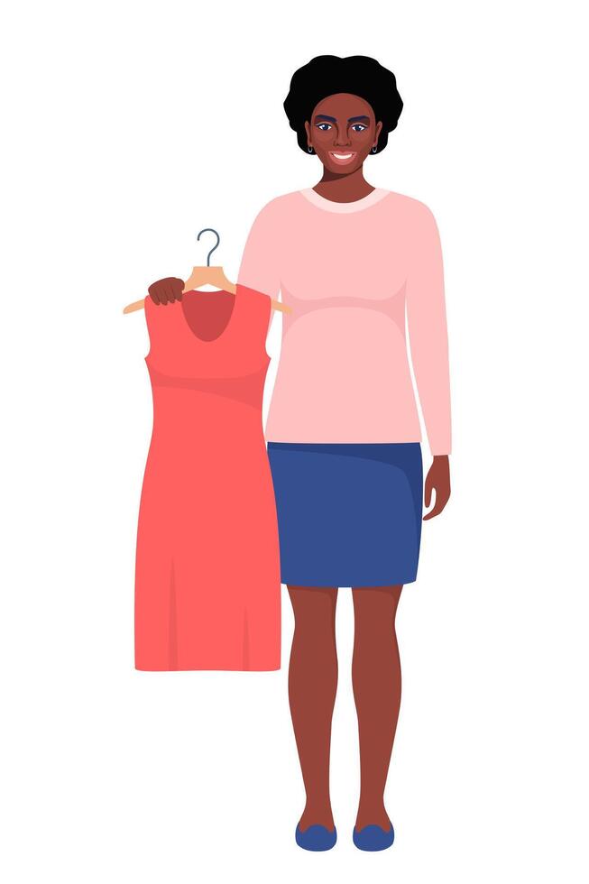sonriente joven negro mujer participación percha con vestido. elegir ... sonriente joven negro mujer participación percha con vestido. elegir ...