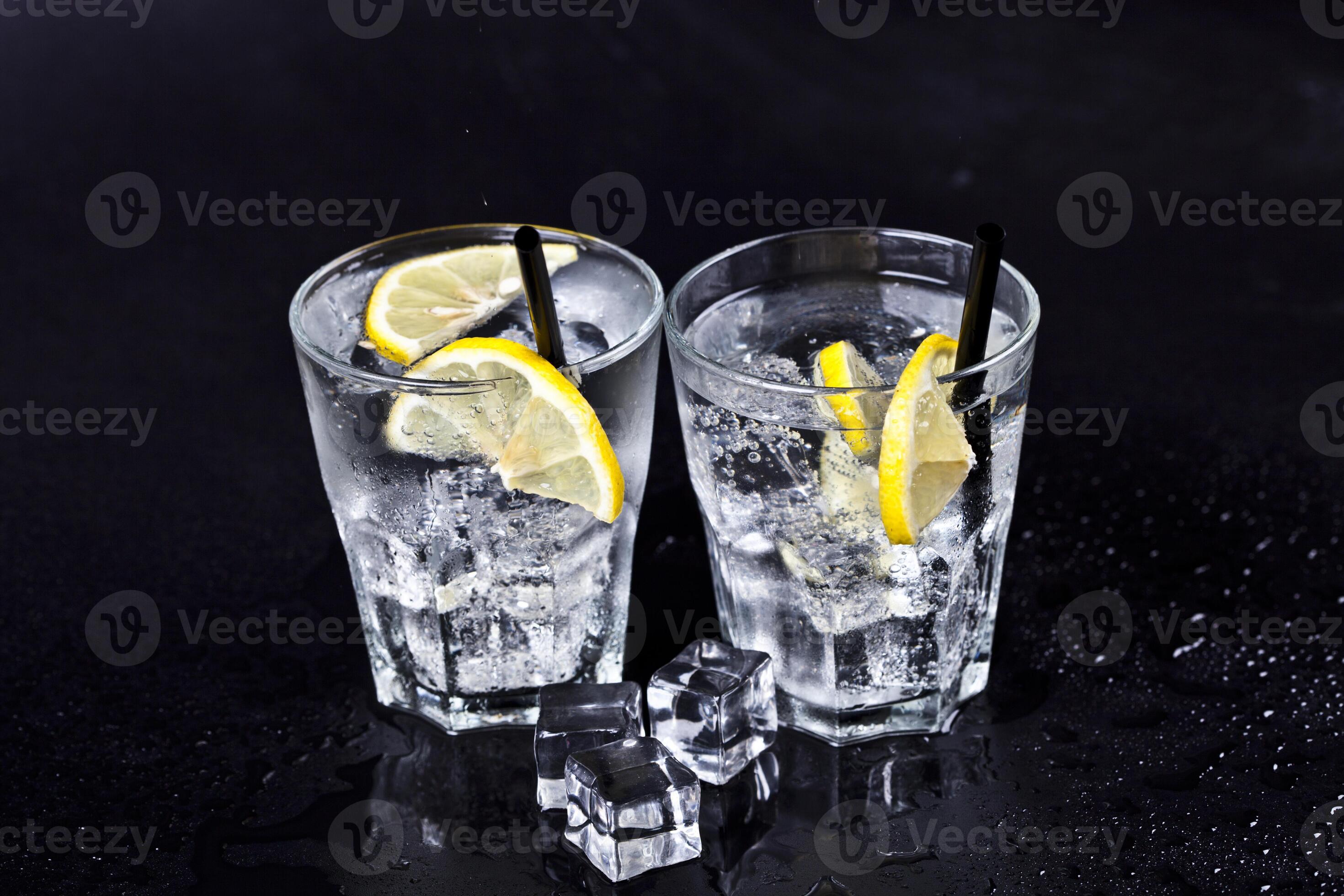 Glasses of fresh cold carbonated water with ice cubes and lemon slices. 52039308 Stock Photo at ...