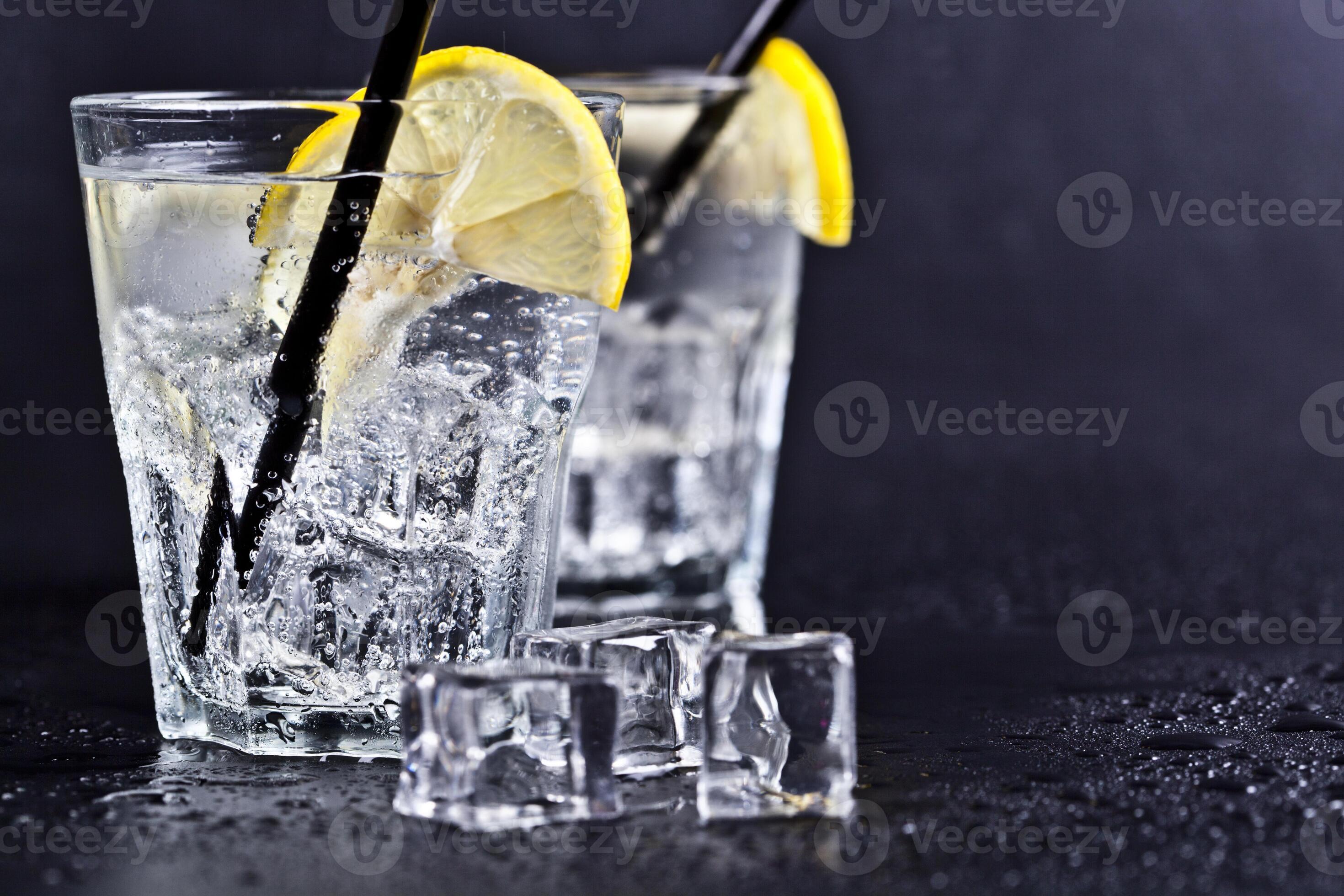Glasses of fresh cold carbonated water with ice cubes and lemon slices. 52039310 Stock Photo at ...
