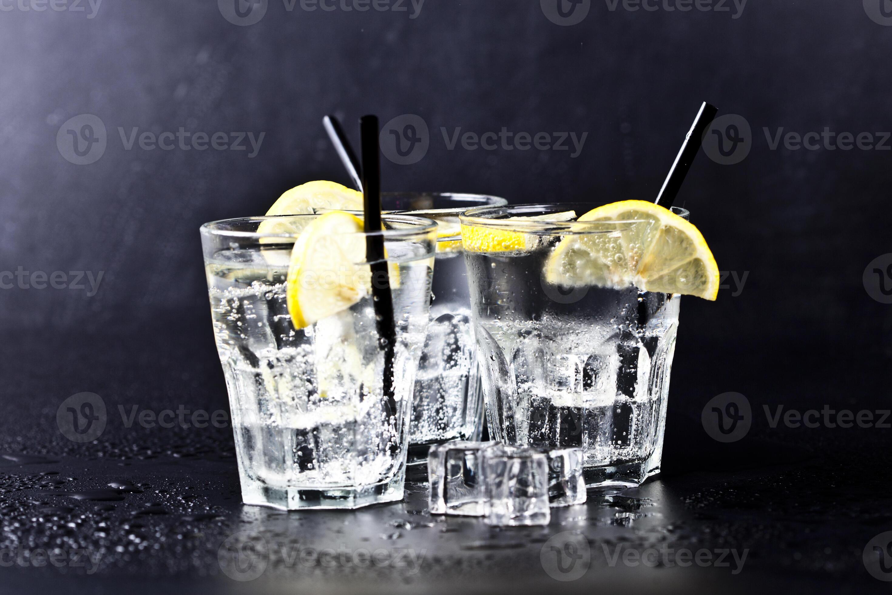 Three glasses of fresh cold carbonated water with ice cubes and lemon slices. 52039314 Stock ...
