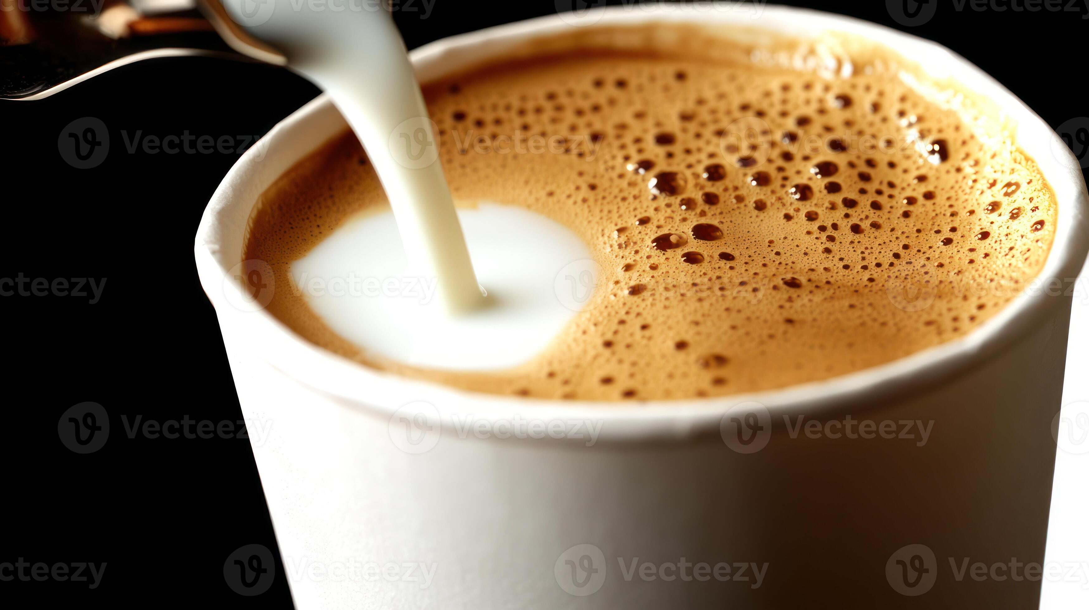 Creamy milk cascades into rich espresso, creating a delightful coffee experience 52071985 Stock ...