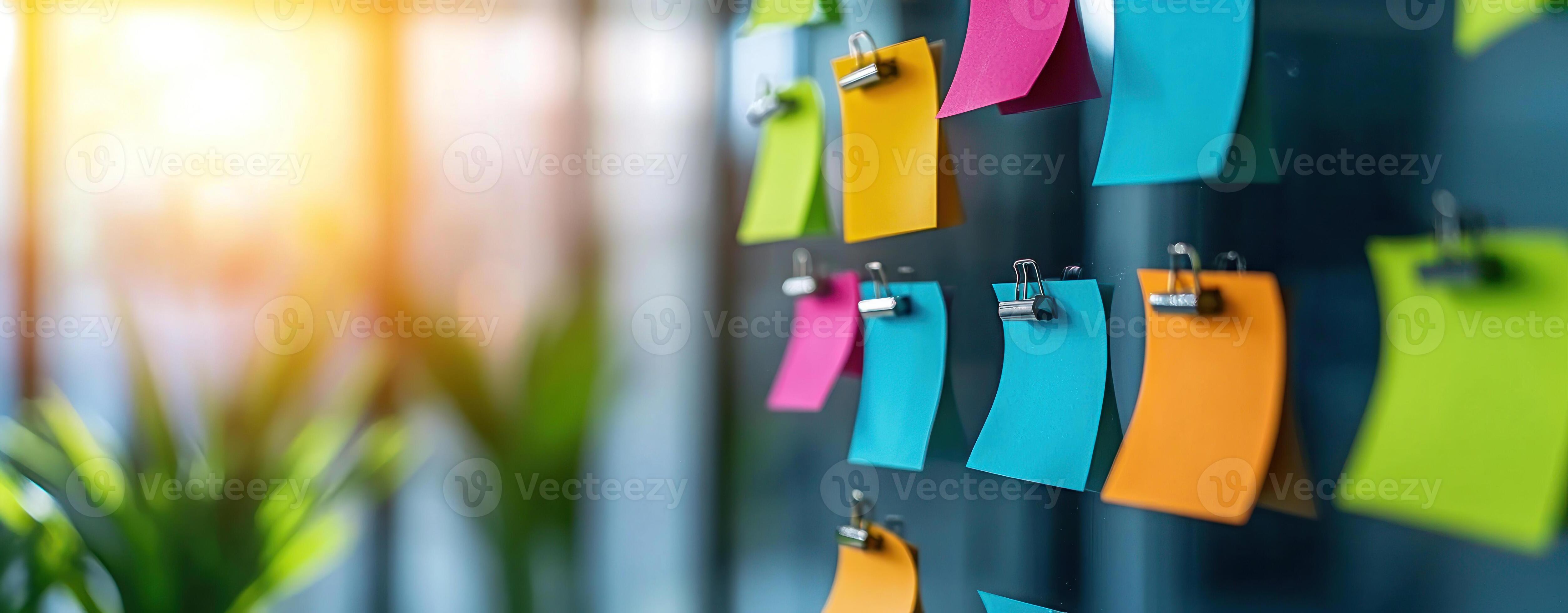 Creative brainstorming session with colorful sticky notes on board ...