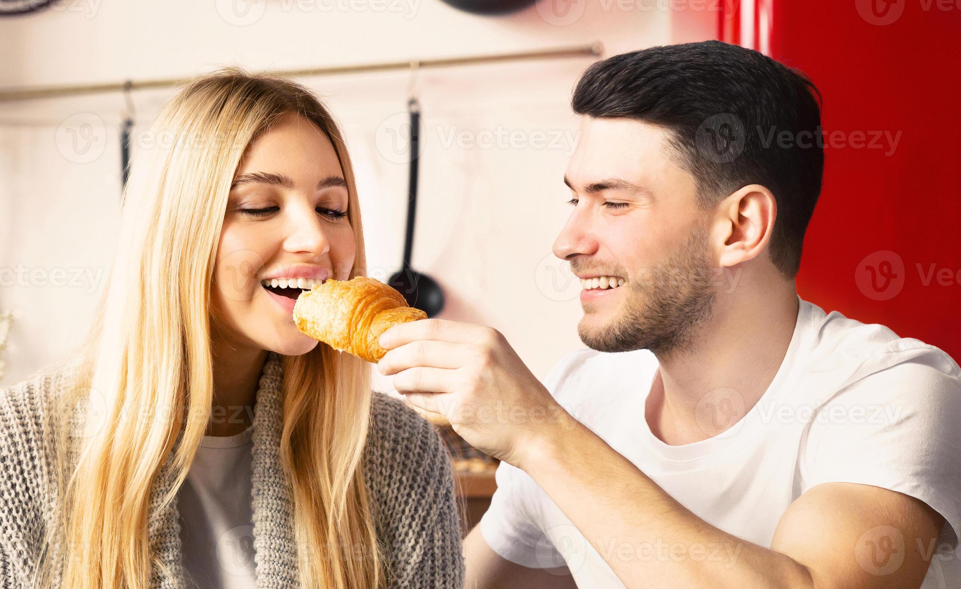 Loving husband and wife enjoying their family brunch together in kitchen 52354643 Stock Photo at ...