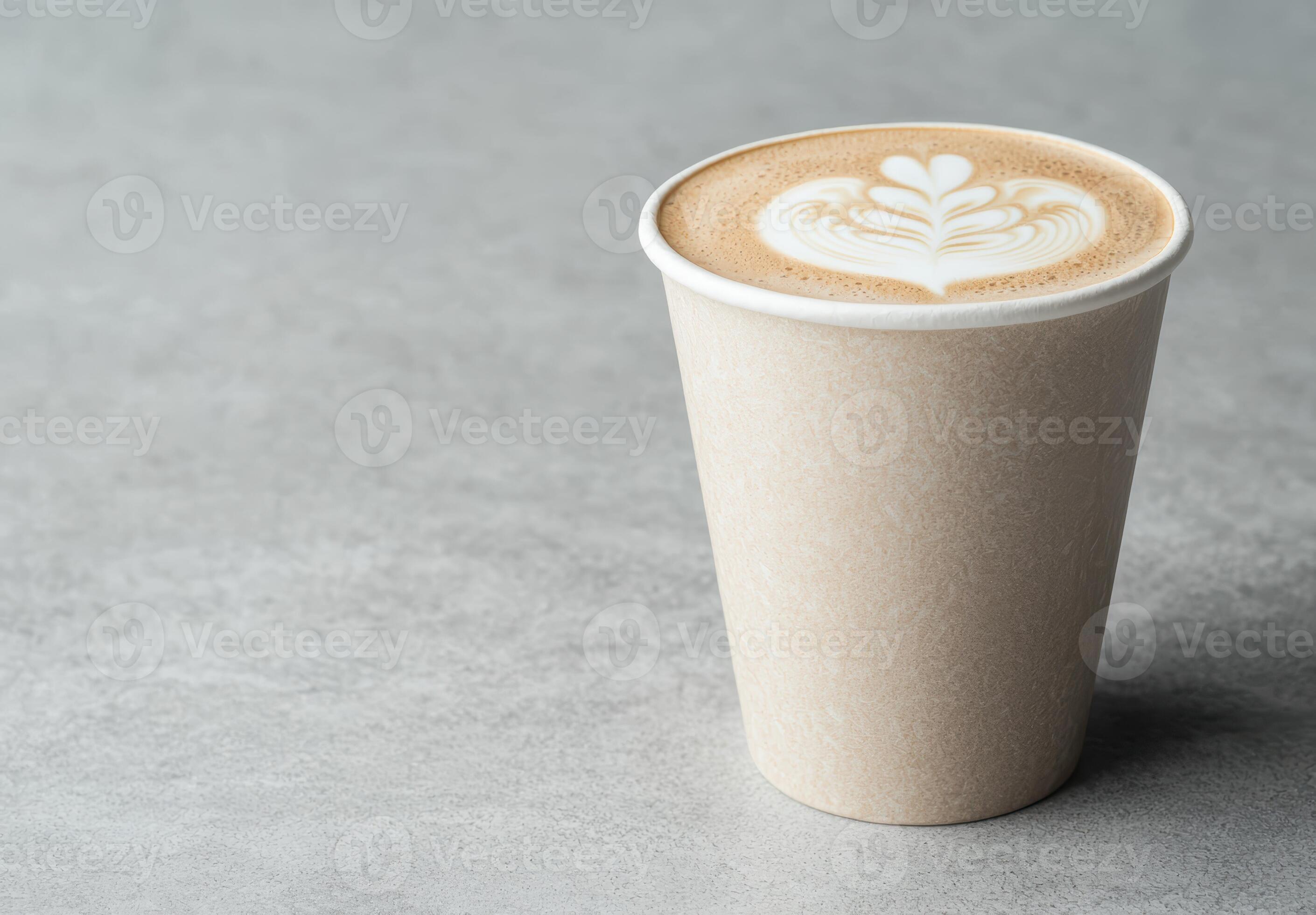 delicious latte art in a paper cup on a grey background 52487595 Stock Photo at Vecteezy