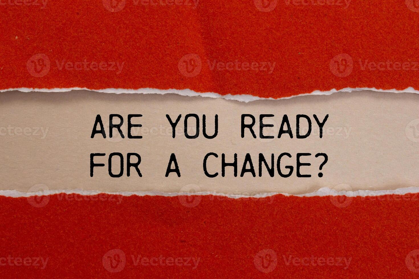 Are you ready for a change message written on ripped torn red paper with beige background ...