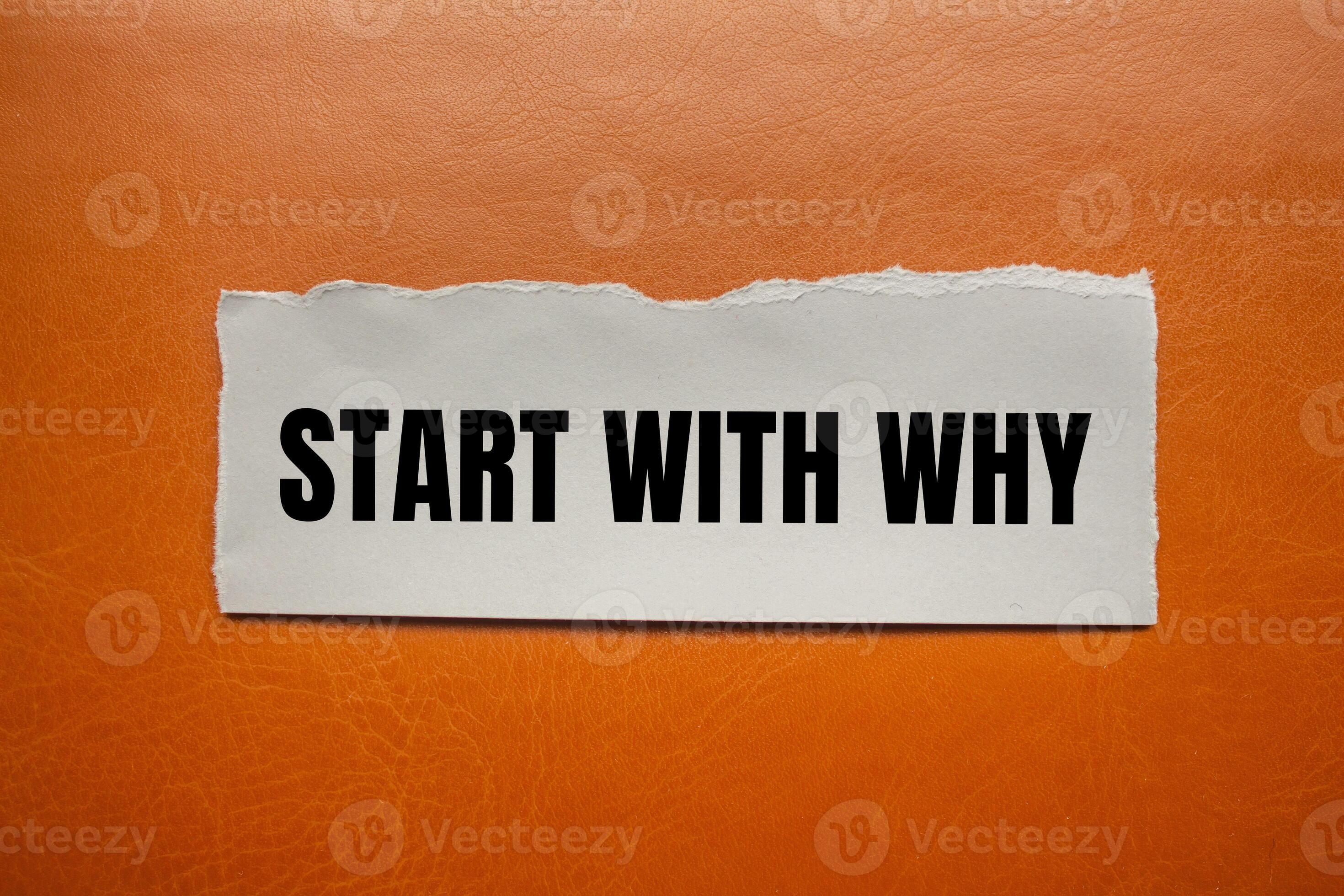 Start with why message written on ripped torn paper piece with brown background. Conceptual ...