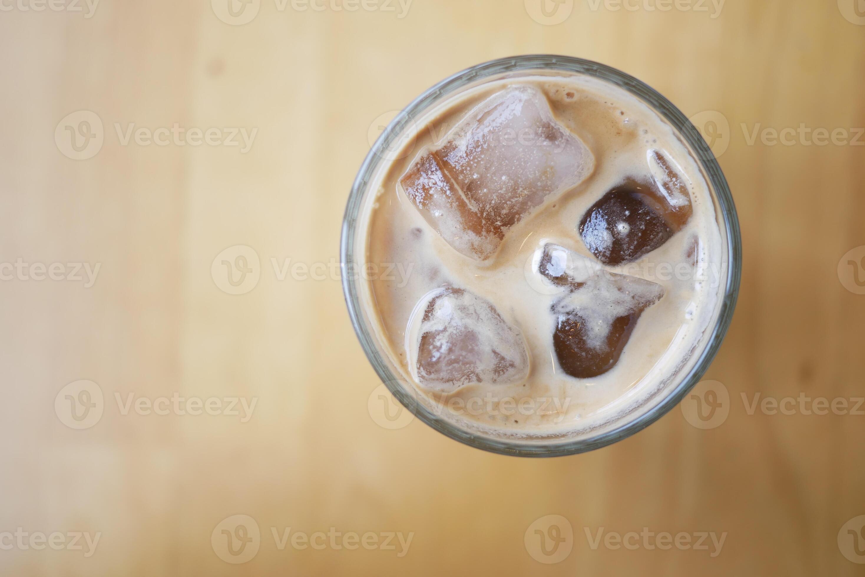Enjoy a Refreshing Iced Coffee, complete with Ice Cubes in a Clear Glass for your delight ...