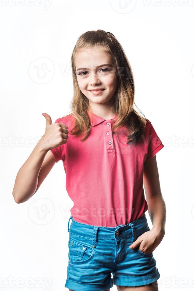 Cute little girl on white background. Little girl showing thumbs up. Emotions of the child ...