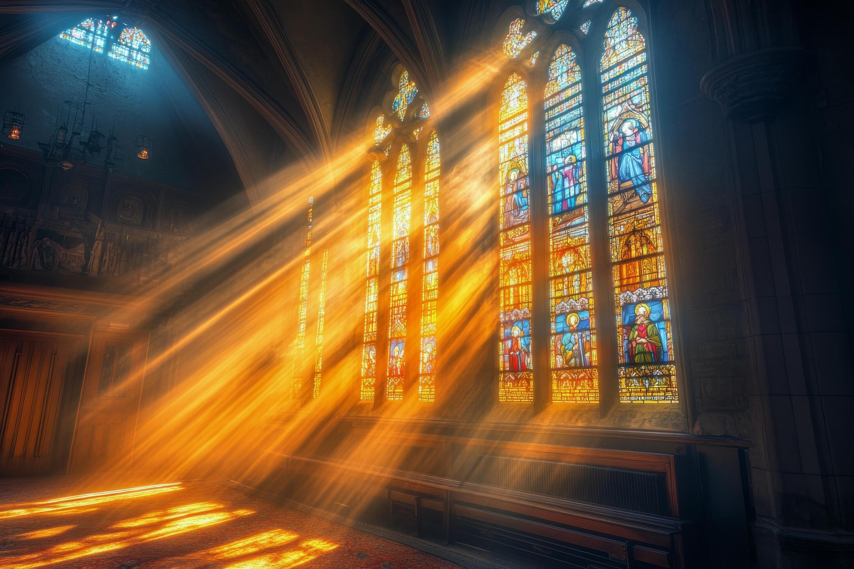Sunlight streaming through stained glass windows in an ancient church during golden hour ...
