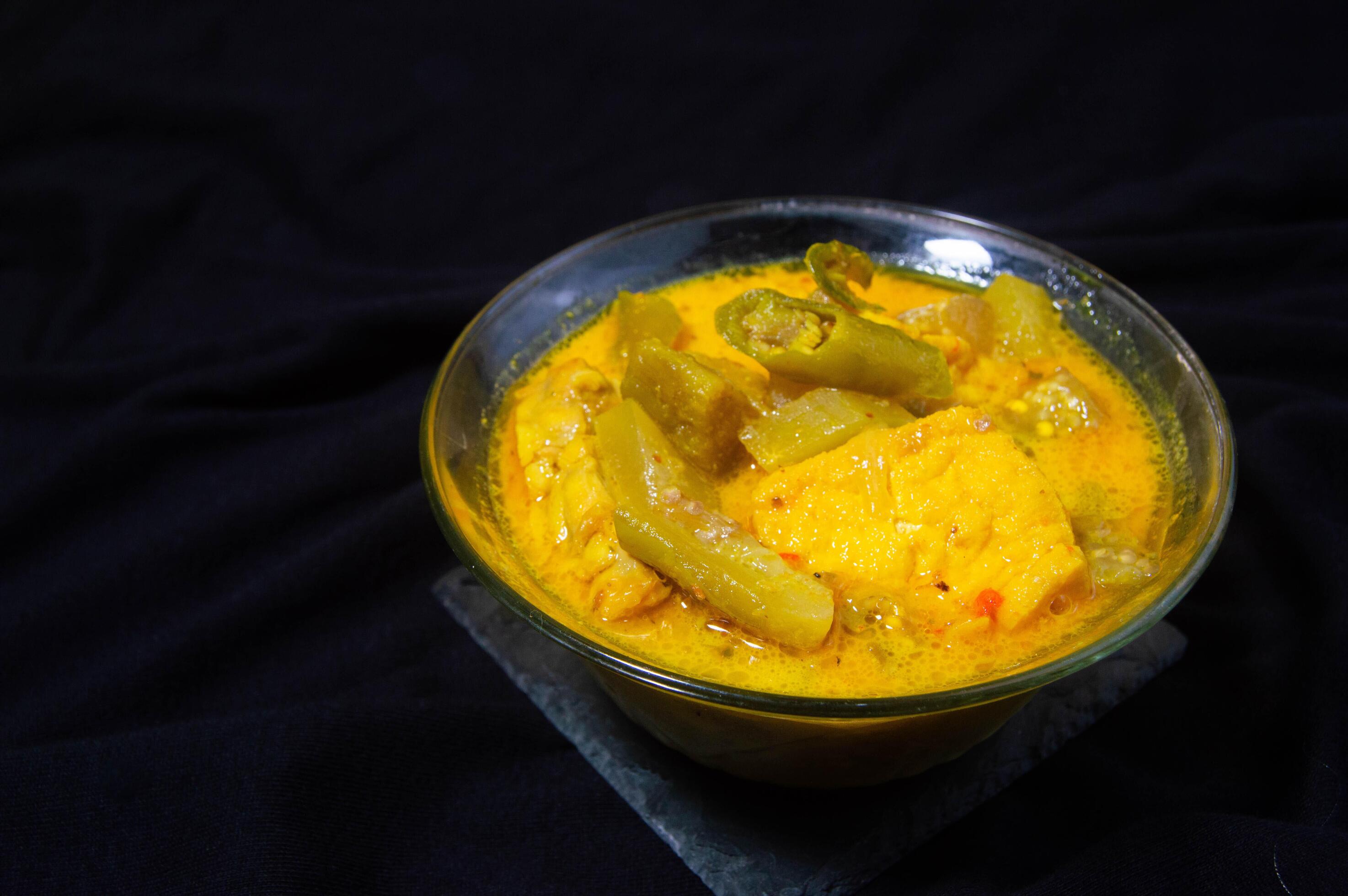 sayur lodeh in a bowl on a black background. Sayur lodeh is a typical ... sayur lodeh in a bowl on a black background. Sayur lodeh is a typical ...