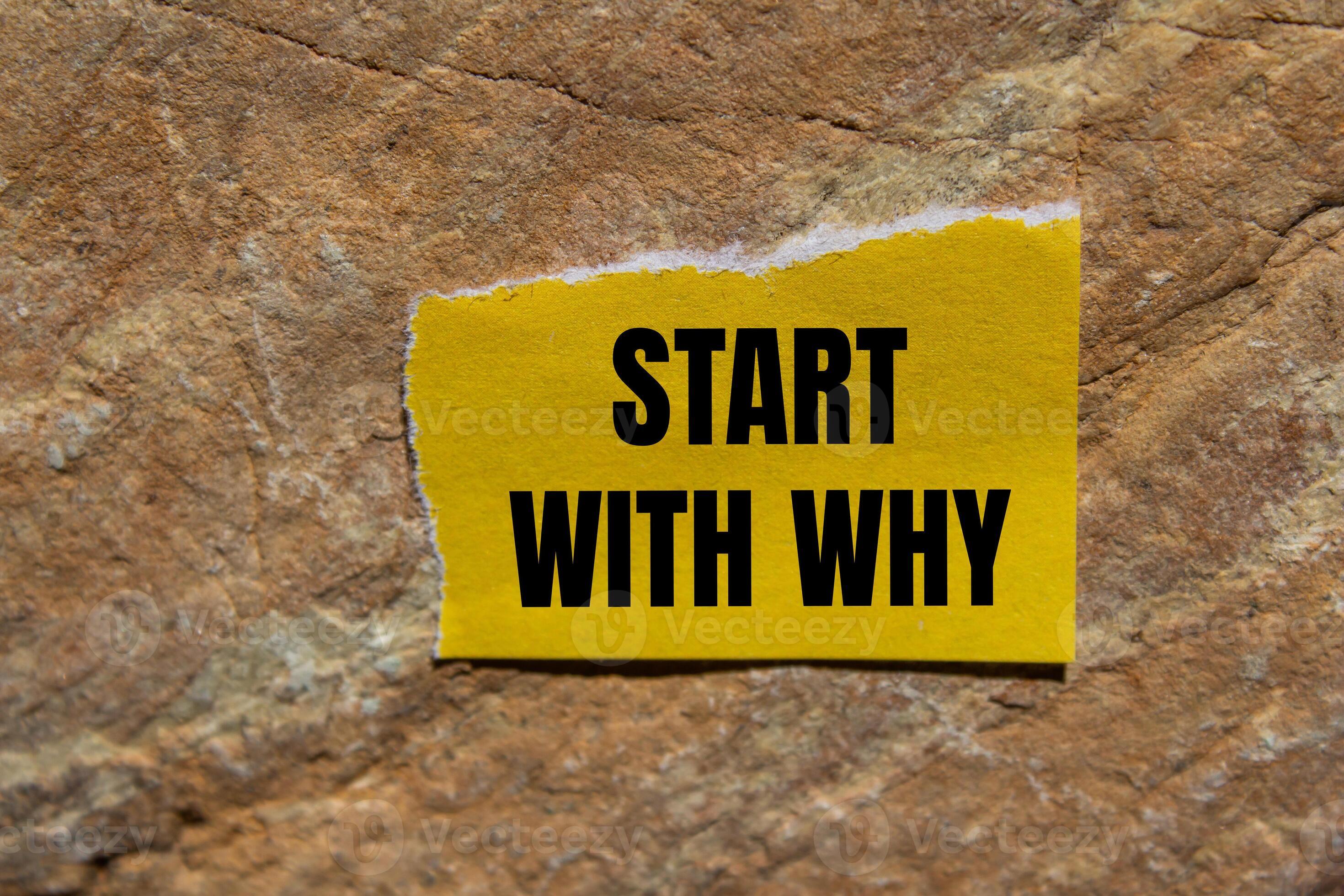 Start with why message written on ripped torn yellow paper piece with stone background ...