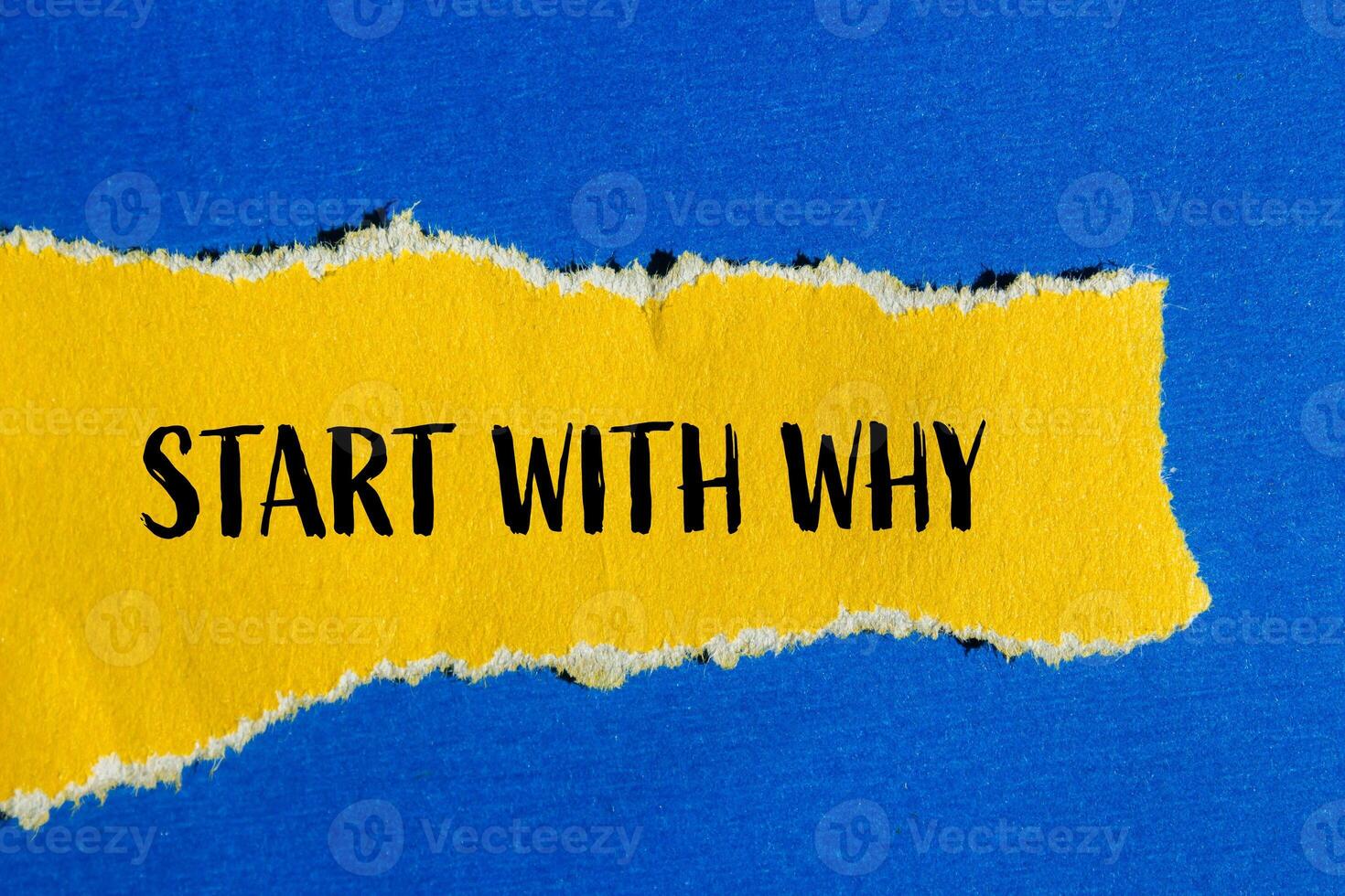 Start with why message written on ripped torn yellow paper piece with blue background ...