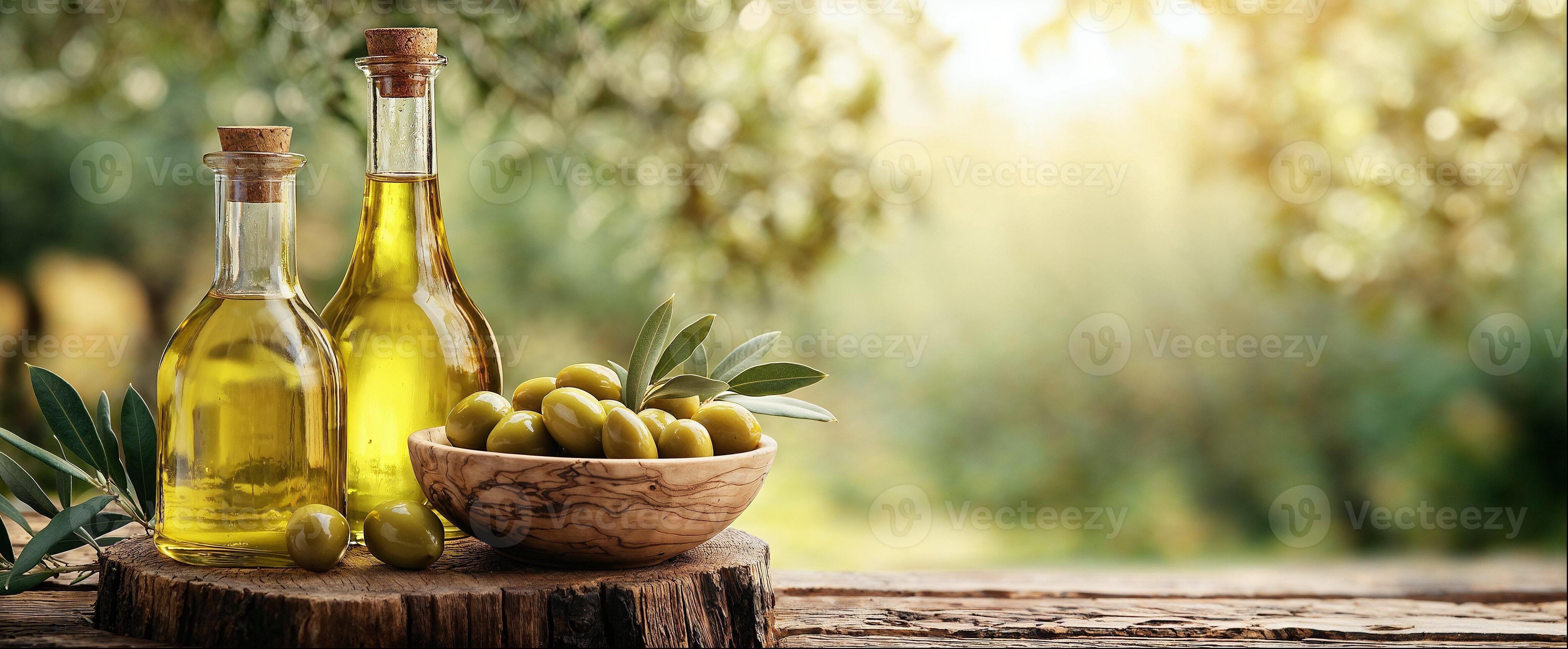 Bottle of olive oil, bowl of freshly harvested olives, old barrel on wooden table, olive tree ...