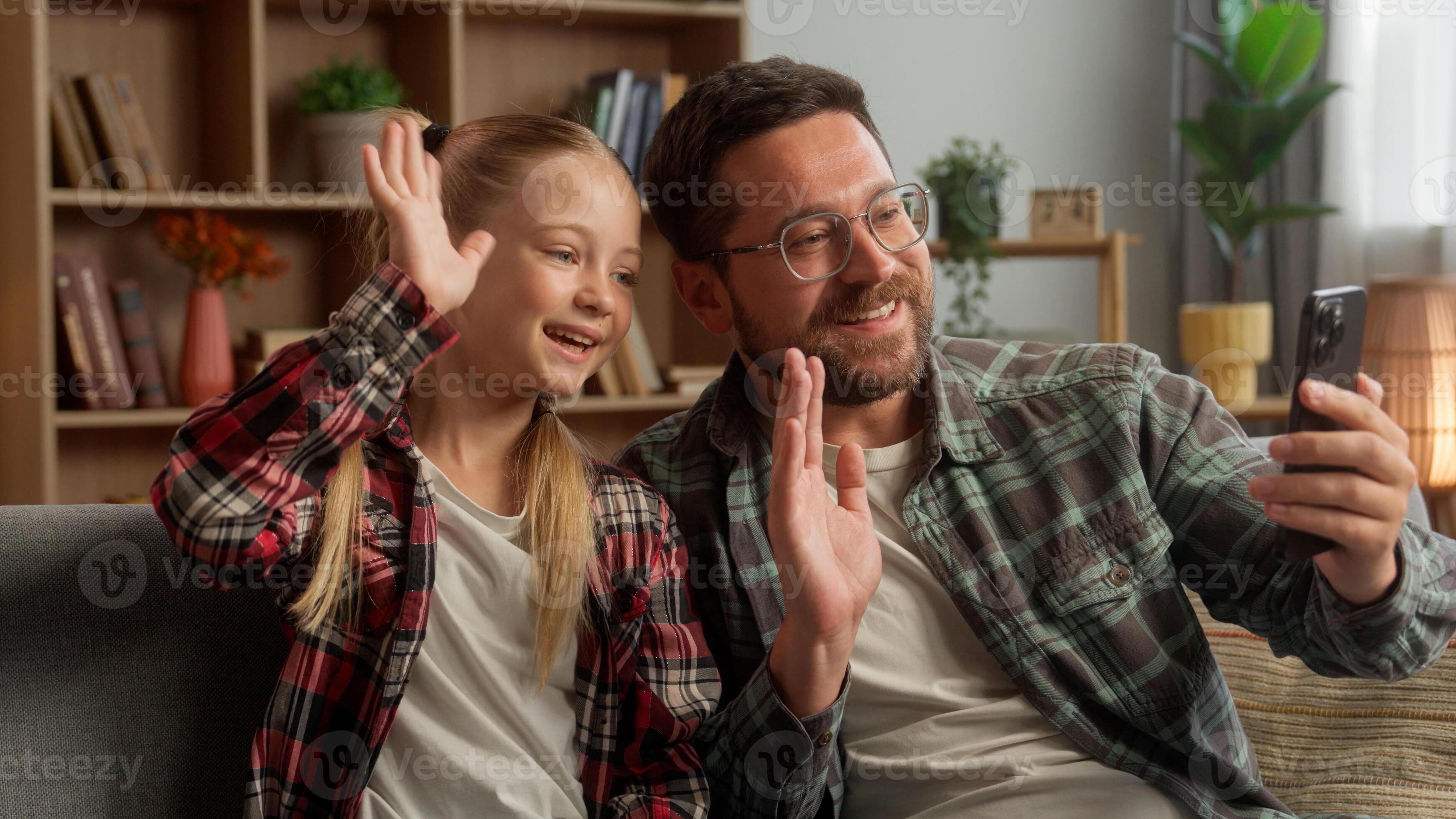 Smiling Caucasian family happy parent dad male guy greet hold mobile phone call online man ...