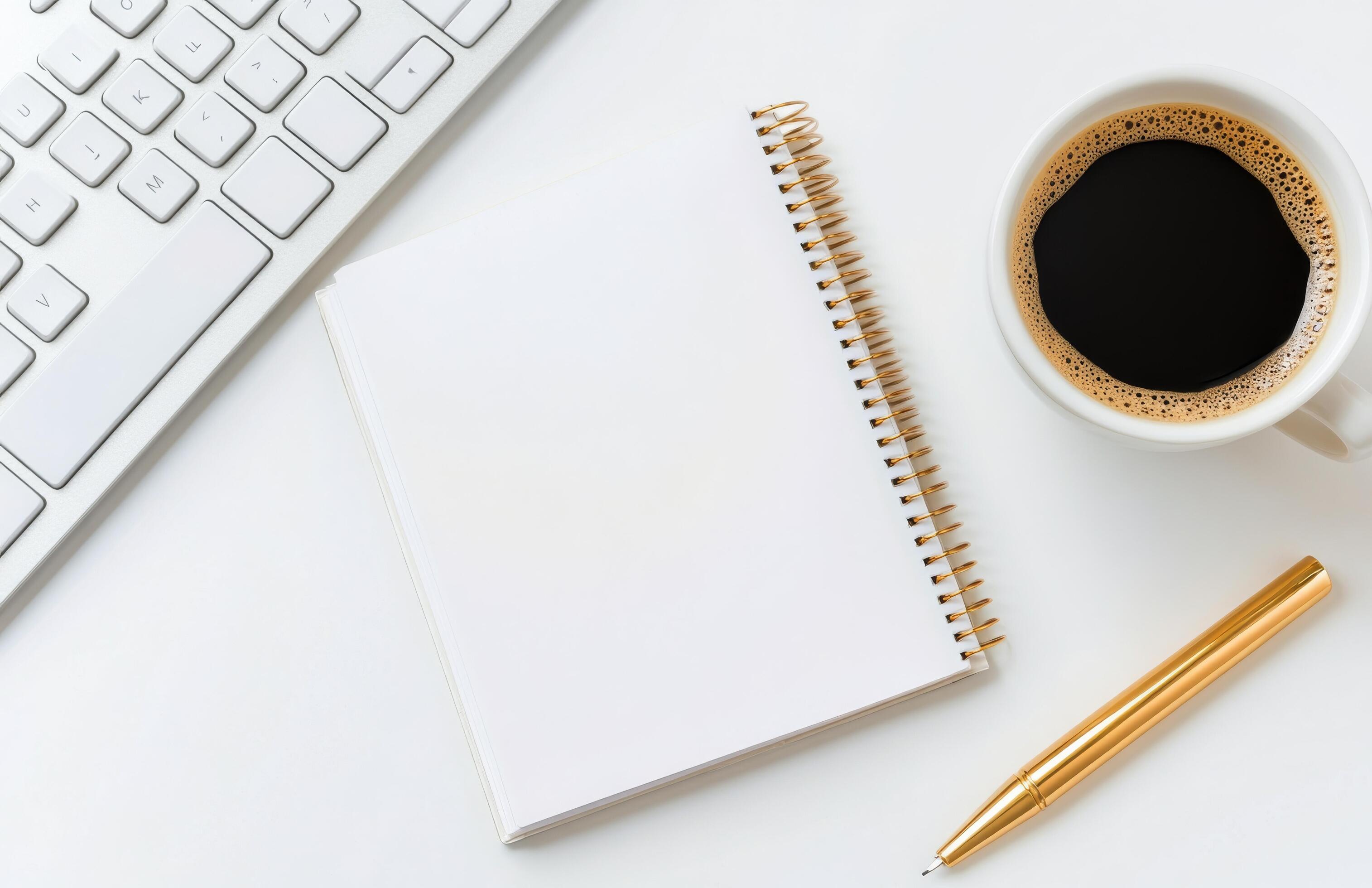Workspace Setup Featuring A Notepad Coffee Cup And Keyboard For