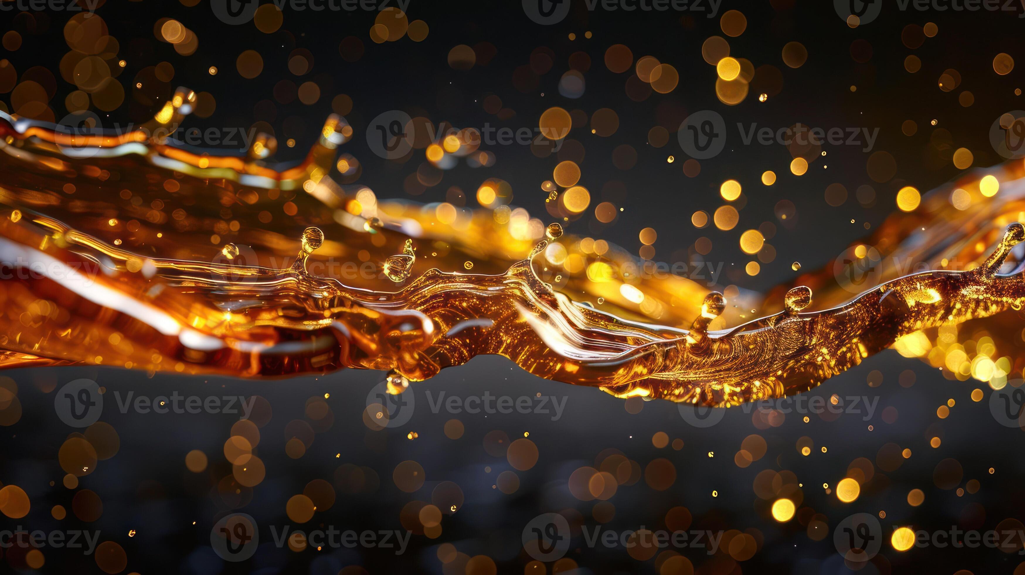 A dynamic splash of liquid with shimmering droplets and golden highlights. 53403101 Stock Photo ...