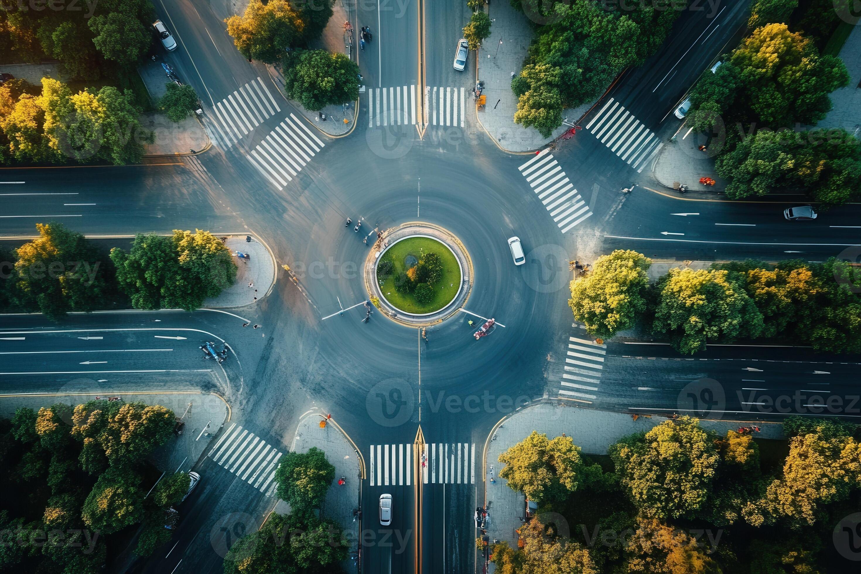 Aerial view of a roundabout intersection with traffic and green spaces. 53424821 Stock Photo at ...