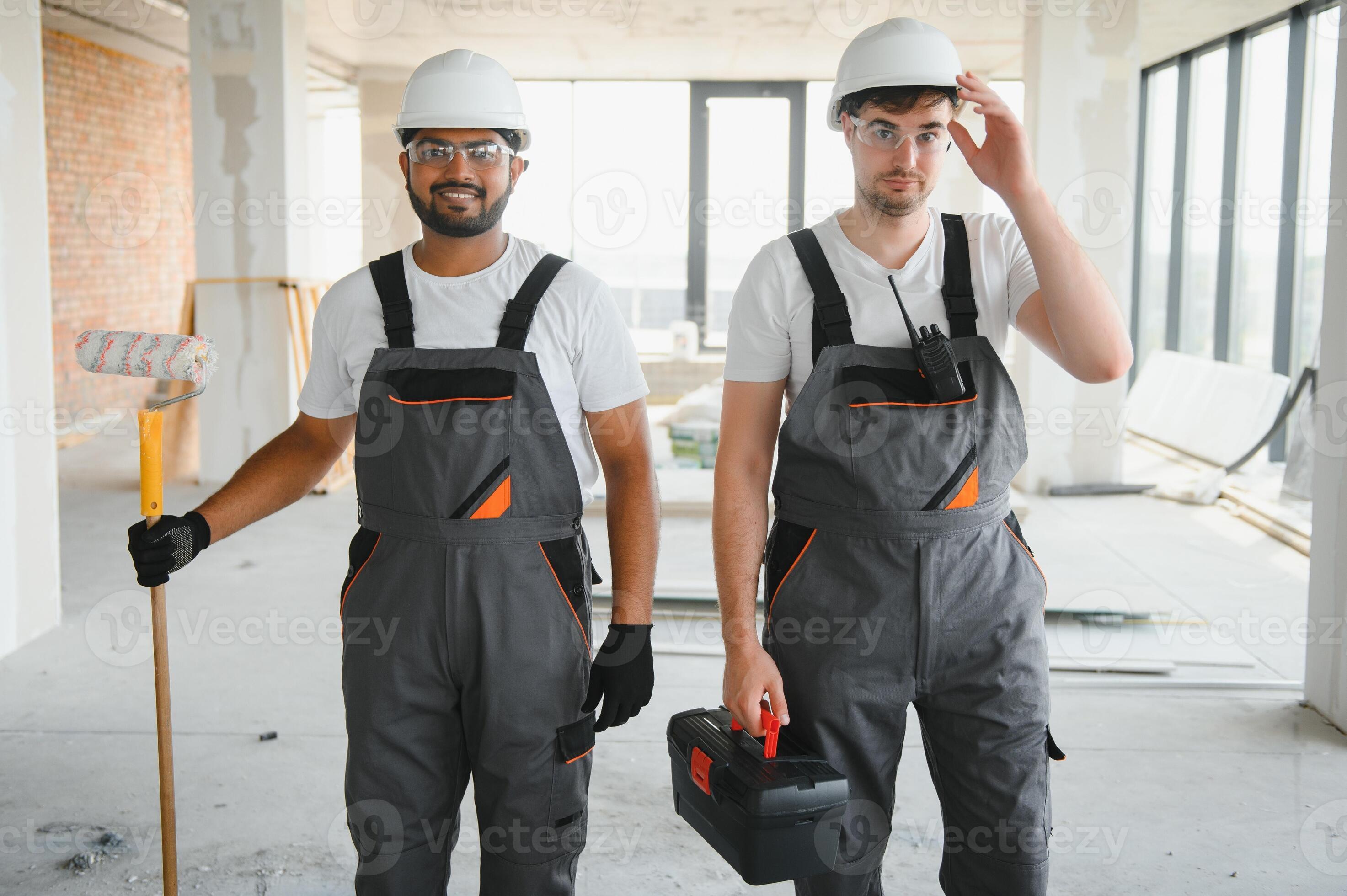 Happy multicultural builders in hardhats 53525984 Stock Photo at Vecteezy