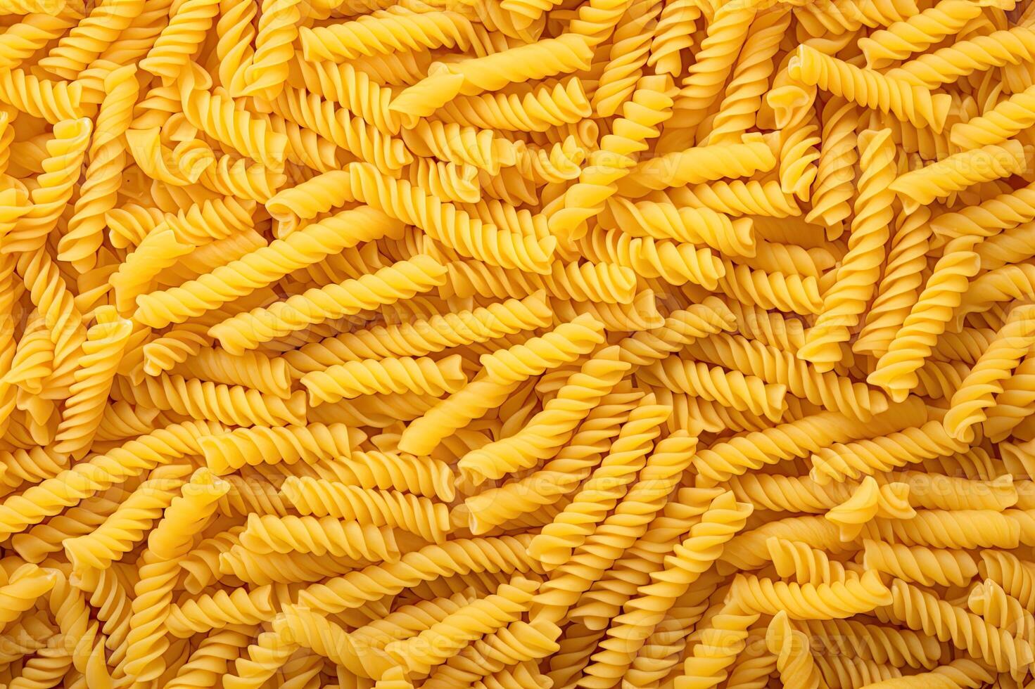 Dry fusilli pasta known for its spiral shape and yellow color is a delicious traditional Italian ...