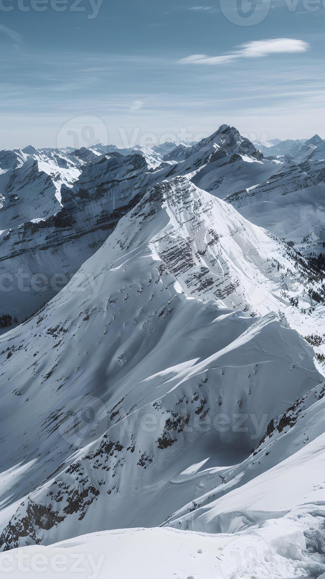 Snowy mountain peaks, rugged valleys stretch toward horizon under clear ...