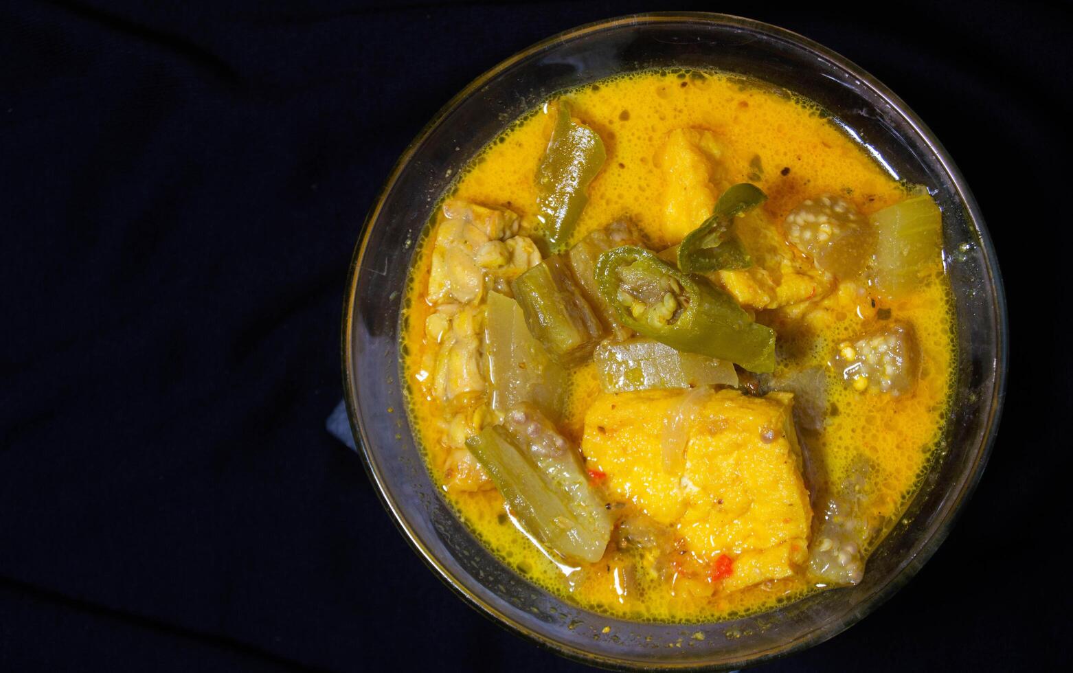 sayur lodeh in a bowl on a black background. Sayur lodeh is a typical ... sayur lodeh in a bowl on a black background. Sayur lodeh is a typical ...