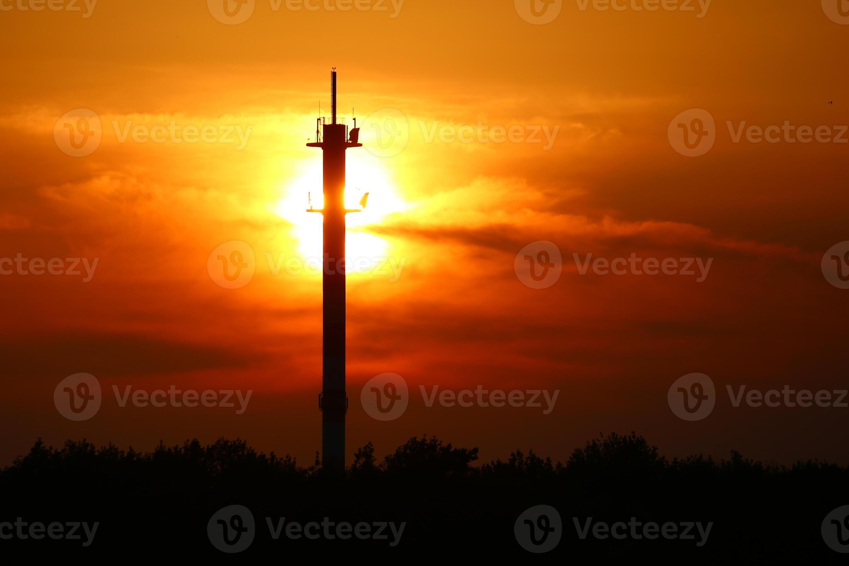 Dark scenic sunset behind a telecommunications tower 53722925 Stock Photo at Vecteezy